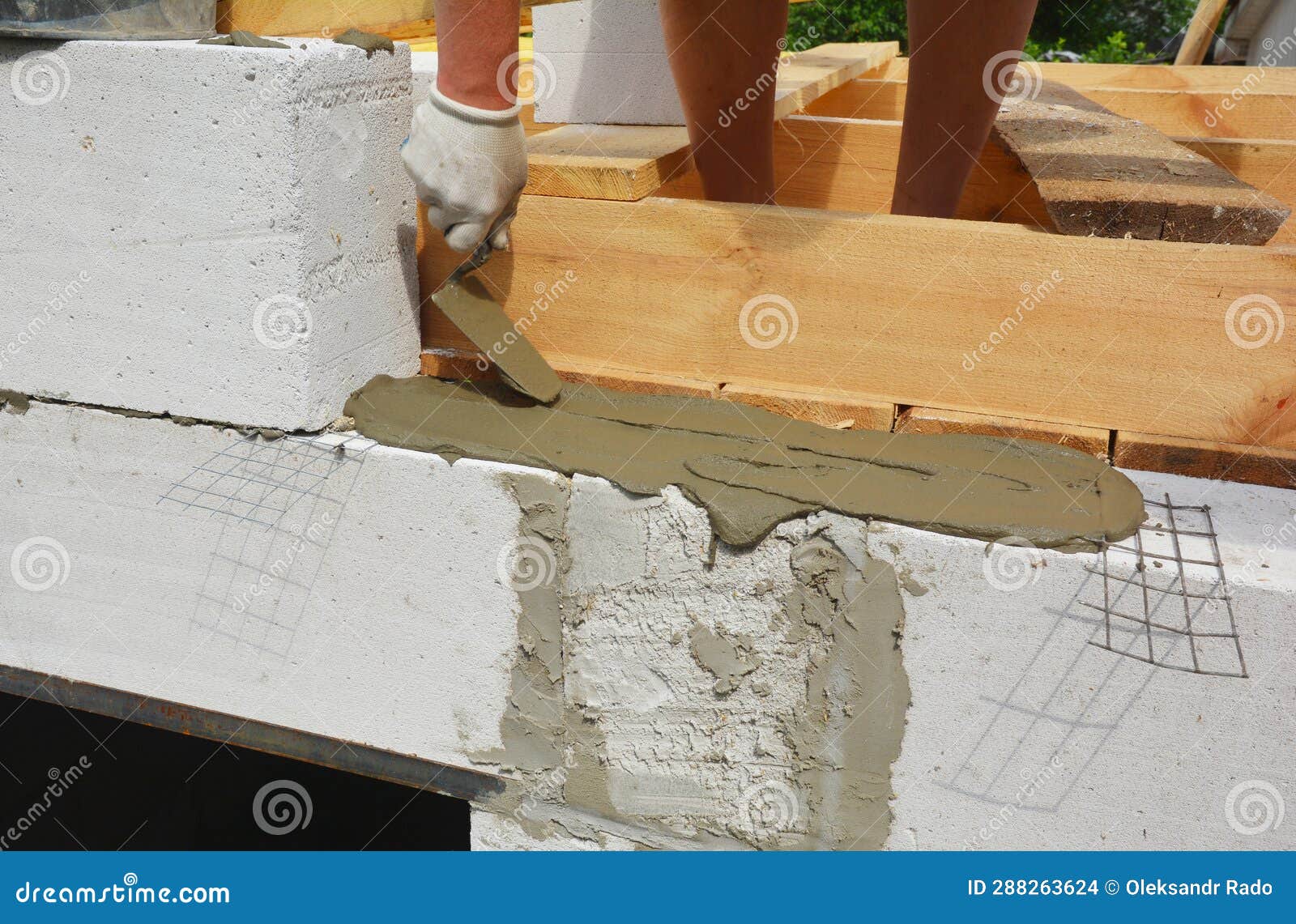 Bricklayer Builder Laying Concrete on Autoclaved Aerated Blocks Wall ...