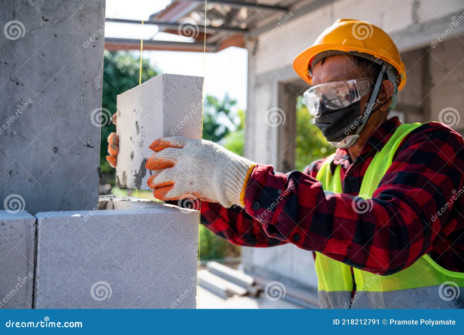 Bricklayer Builder Working with Autoclaved Aerated Concrete Blocks ...
