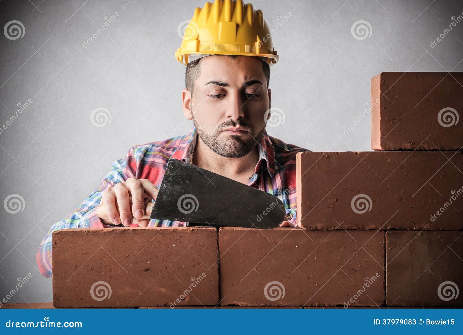 Bricklayer building a wall stock image. Image of construct - 37979083