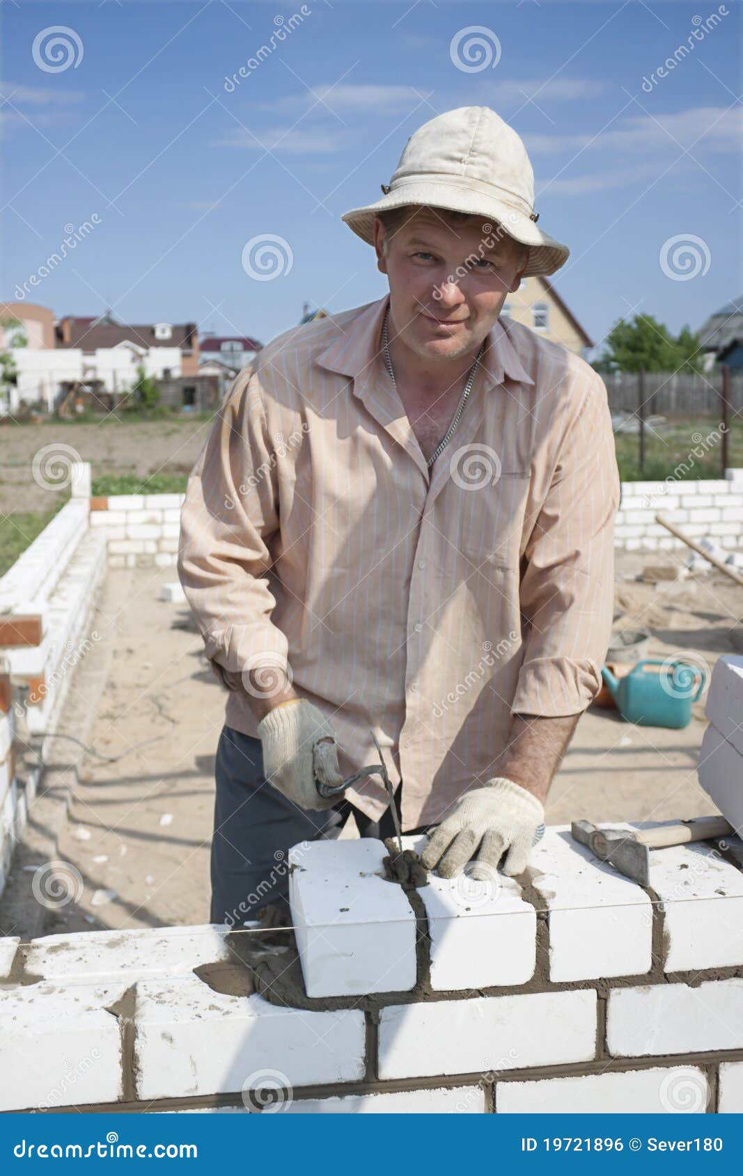Bricklayer builds a wall stock photo. Image of site, reconstruction ...
