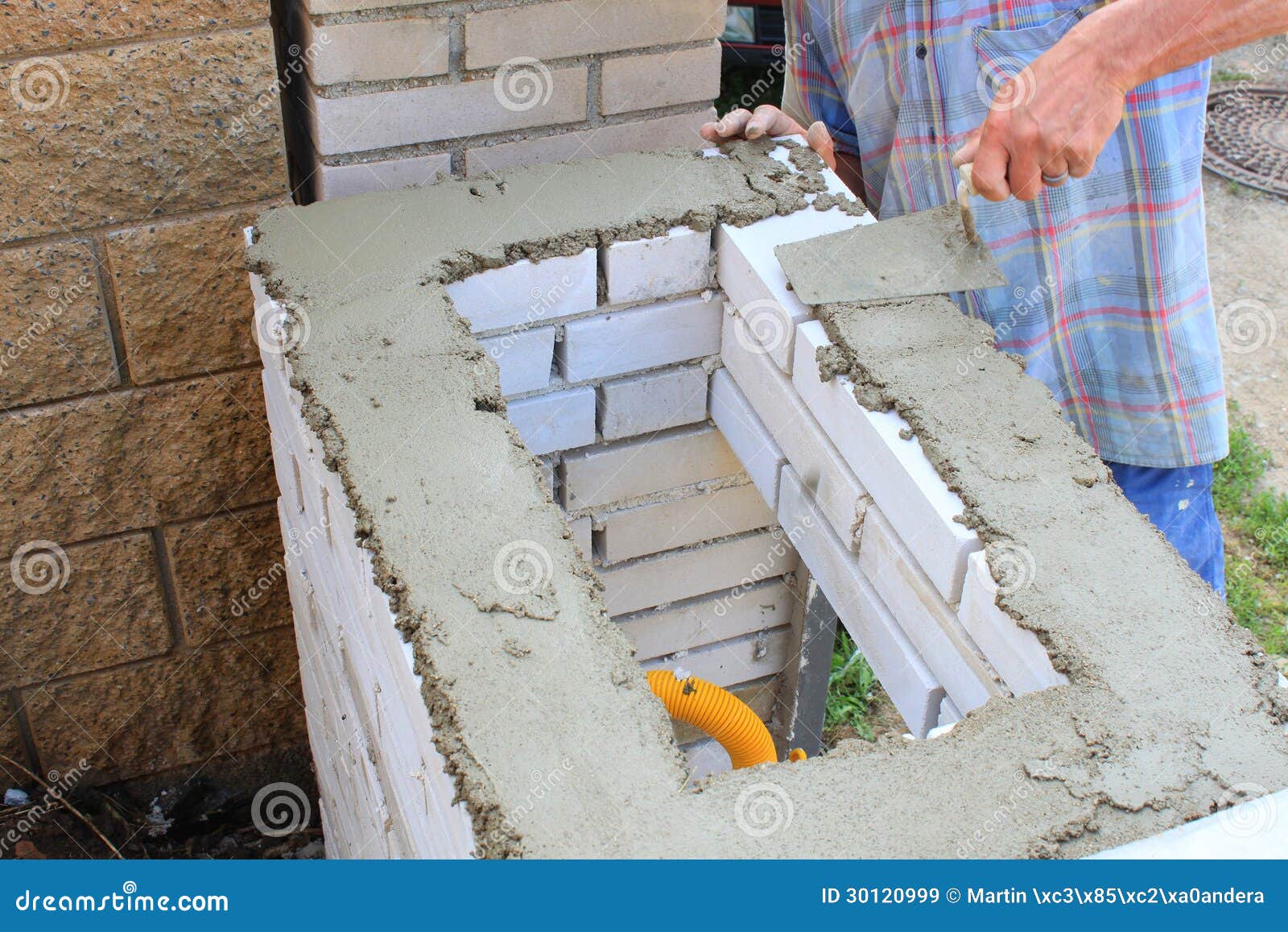 Bricklayer builds a wall stock image. Image of concrete - 30120999