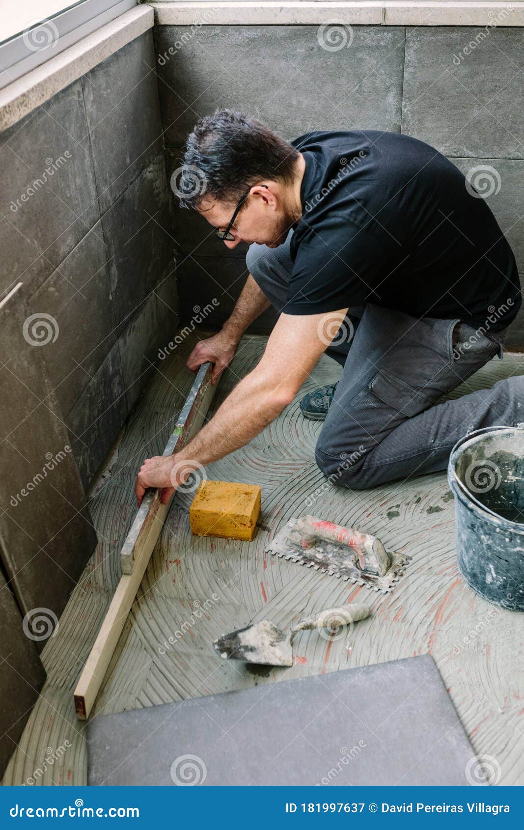 Bricklayer Checking Floor with a Level Stock Image - Image of mason ...