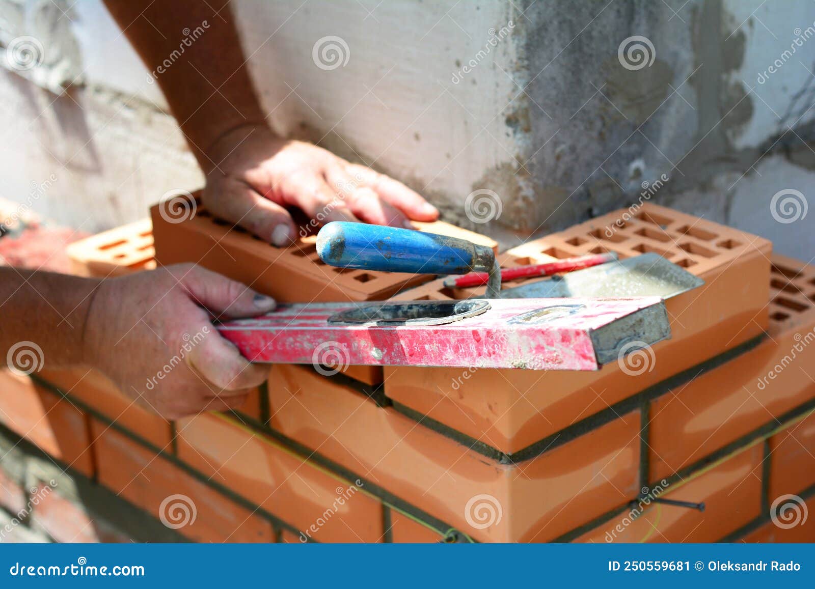 Bricklayer is Checking with a Spirit Level If the Corner of a Brick ...