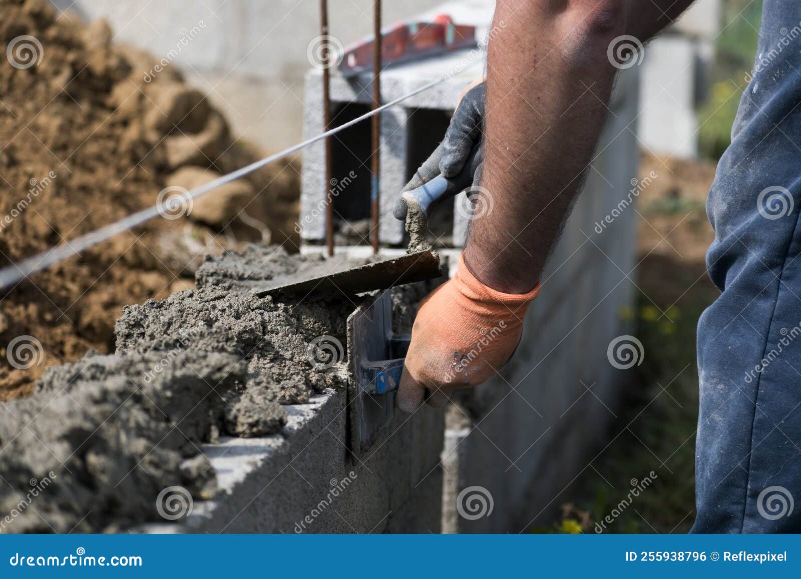 Bricklayer in Glove Spreading Concrete To Build a Wall on Construction ...