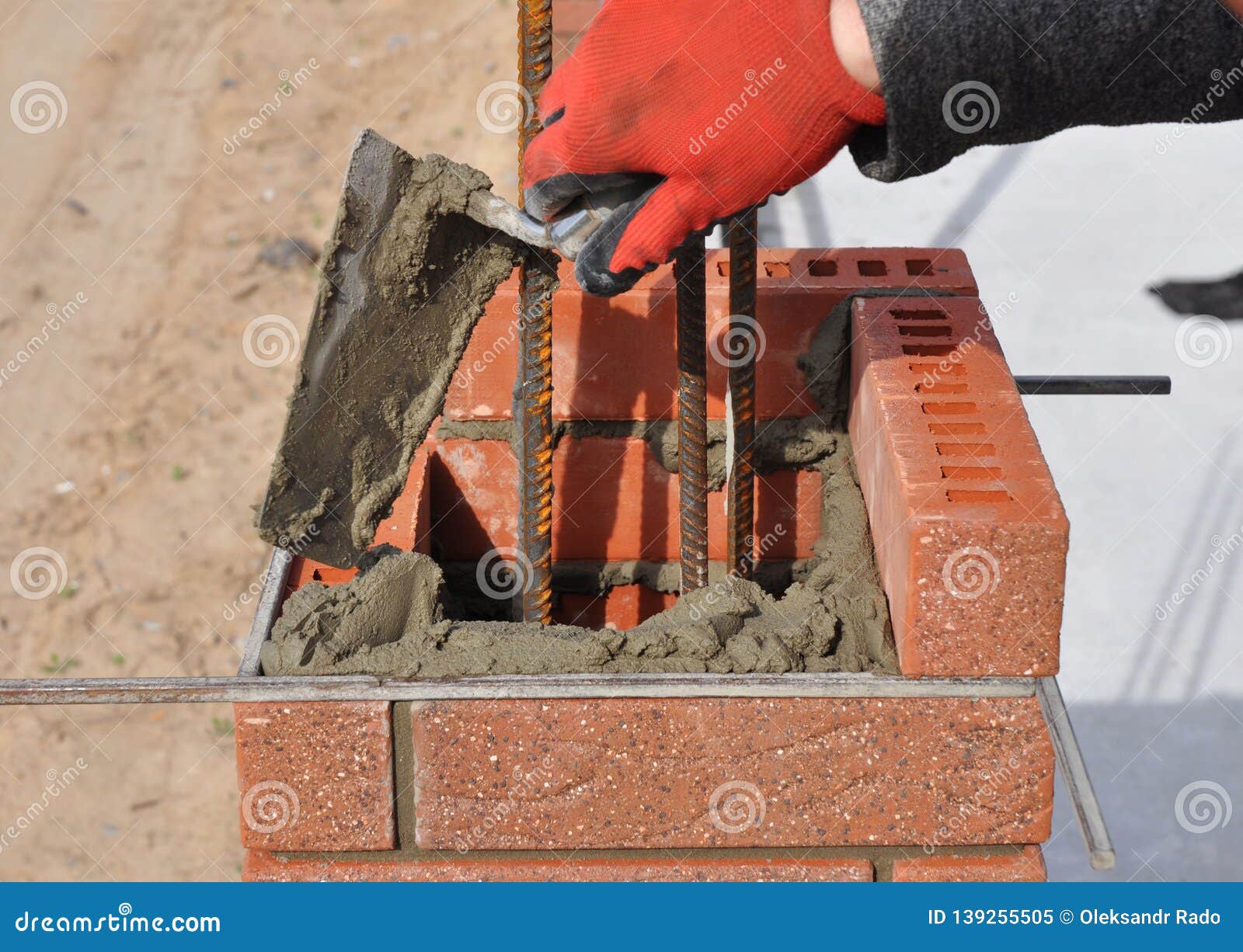 Bricklayer Hand Laying Brick Column with Metal Rod Stock Image - Image ...