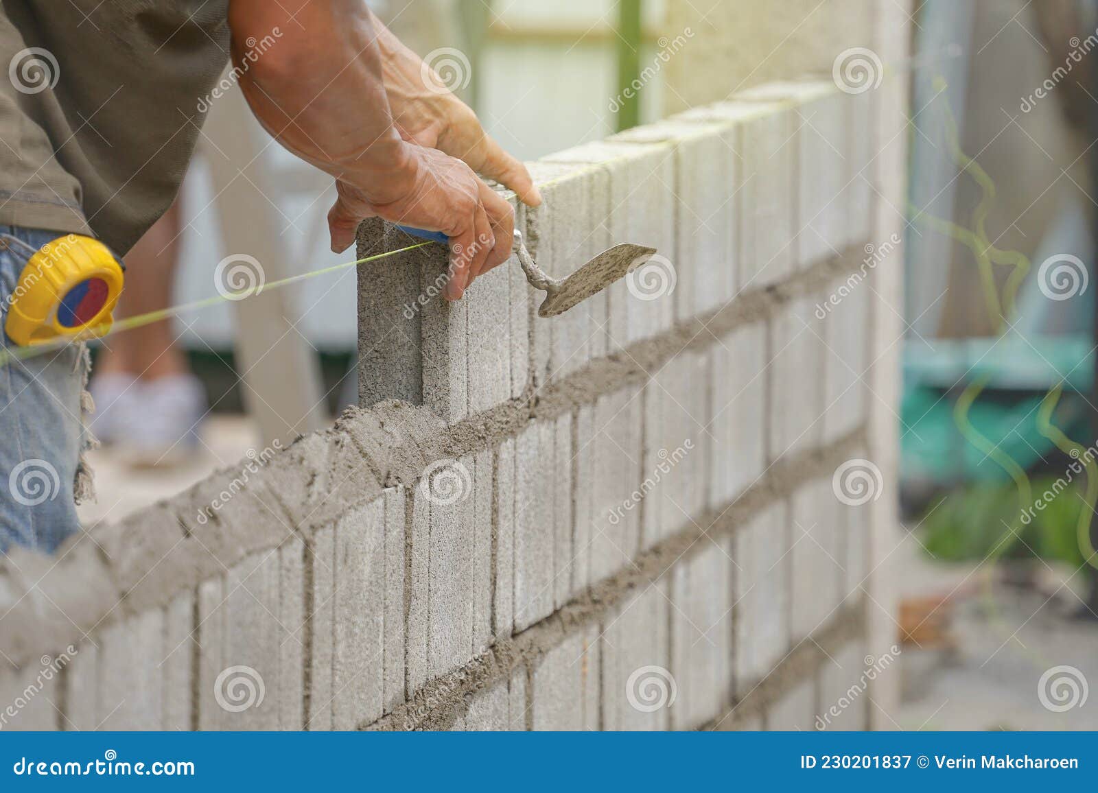 Bricklayer Hands Hold Aluminium Brick Trowel Installing Brick Blocks on ...