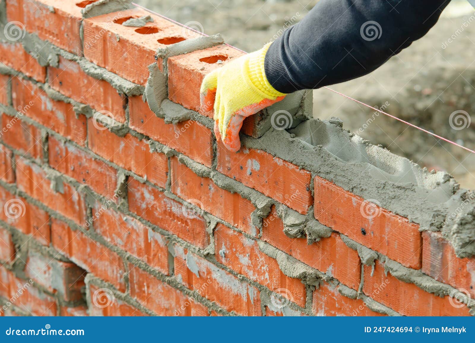 Bricklayer Laying Bricks on Mortar on New Residential House ...