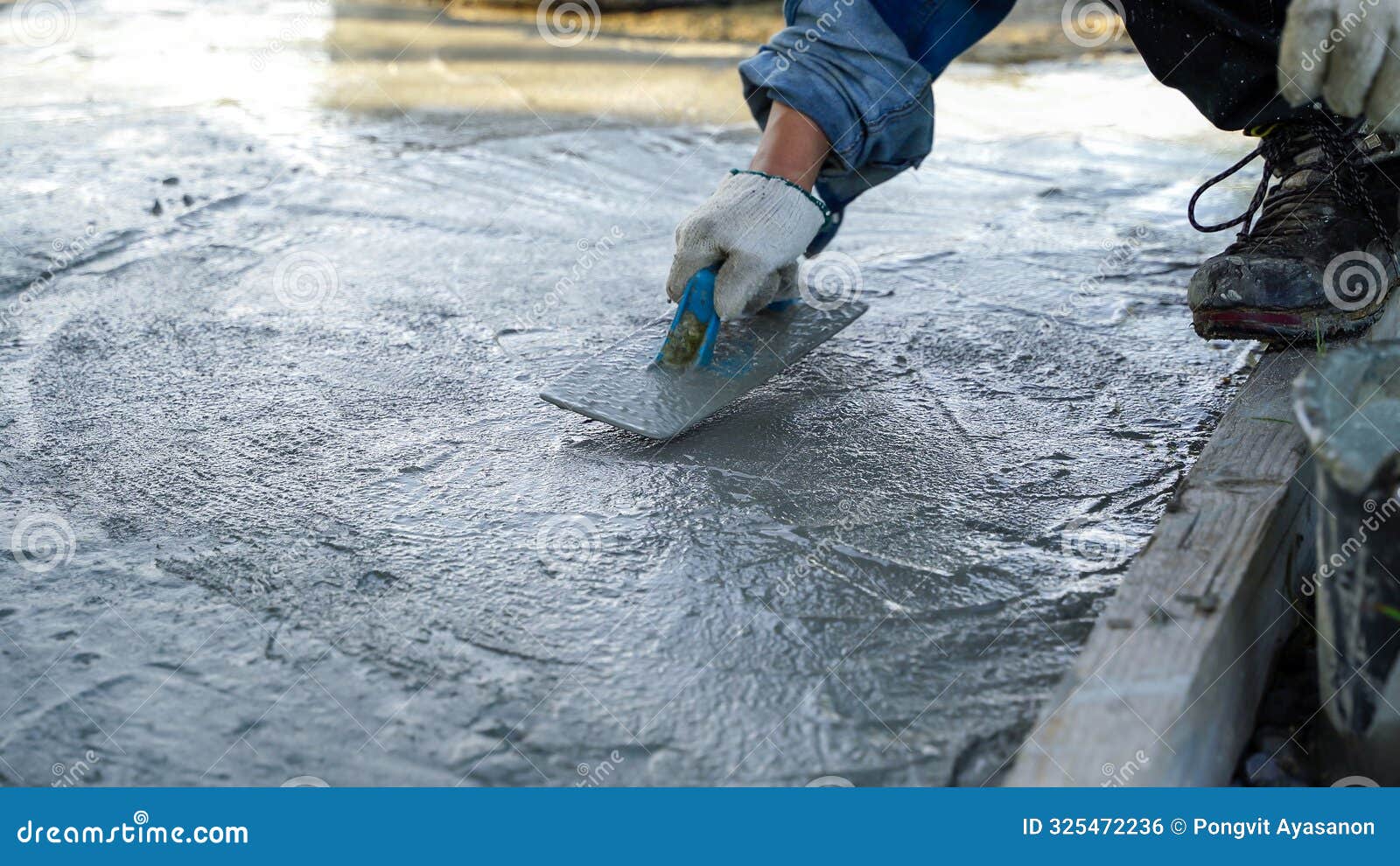 Bricklayer Laying Concrete To Create a Cement Floor Inside the House ...