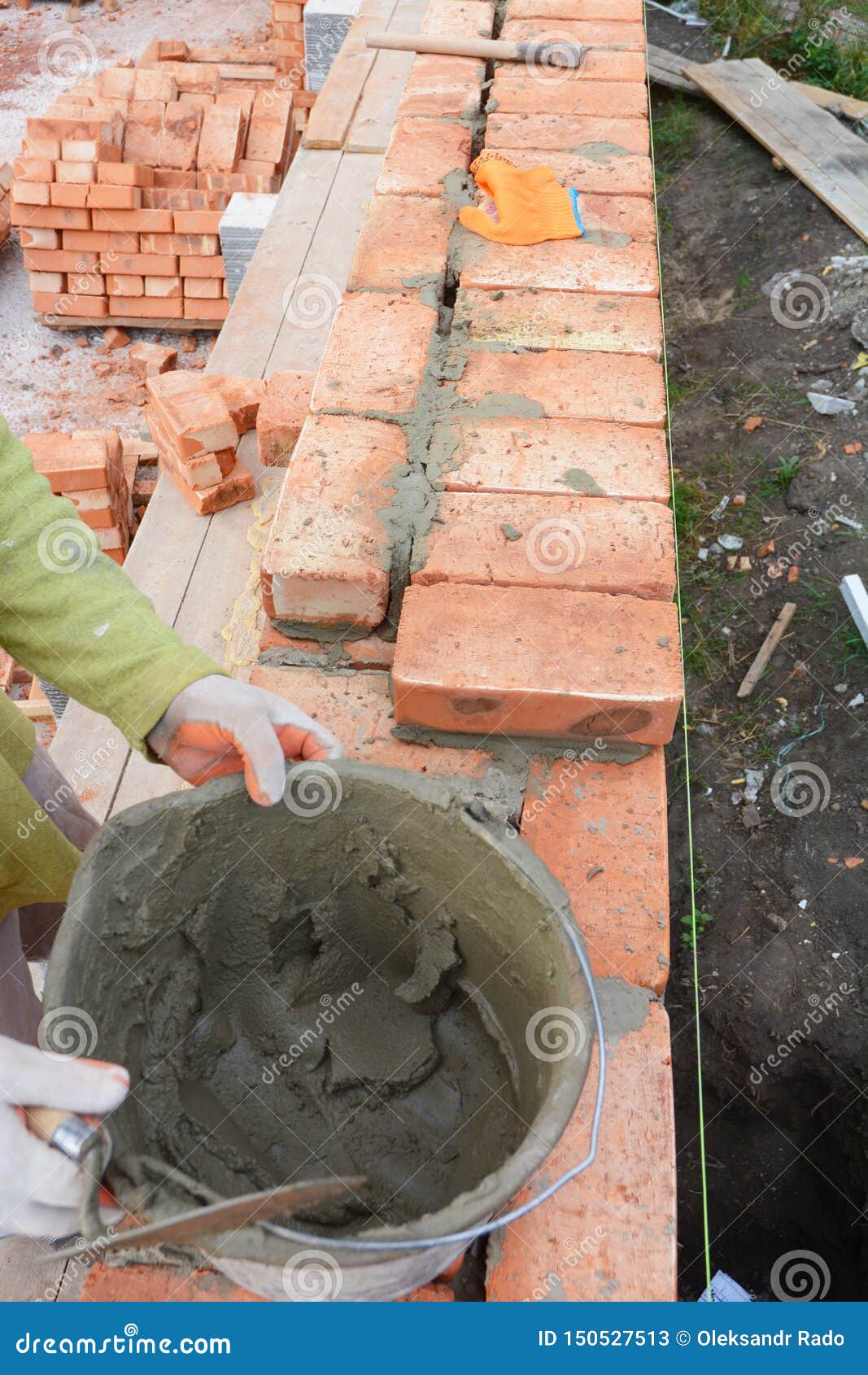 Bricklayer Laying House Brick Wall from Red Bricks. Masonry Stock Image ...