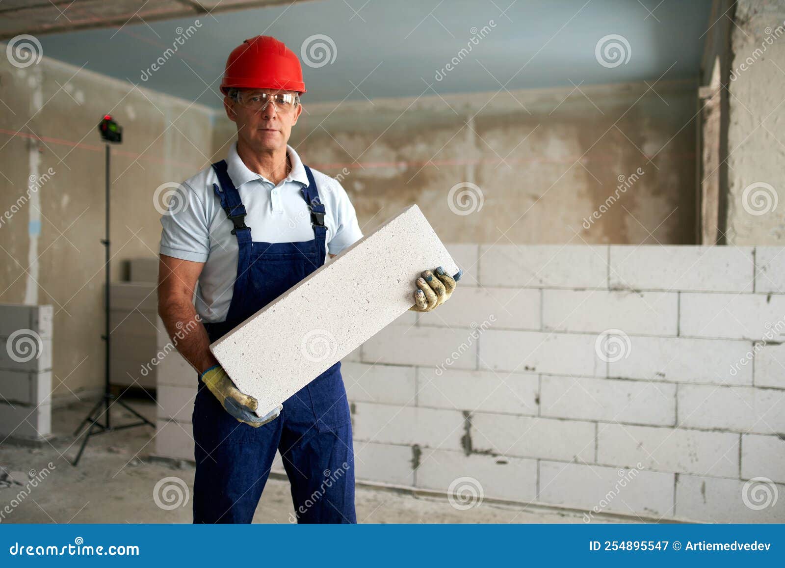 Bricklayer or Mason Constructs Wall of Autoclaved Aerated Concrete ...