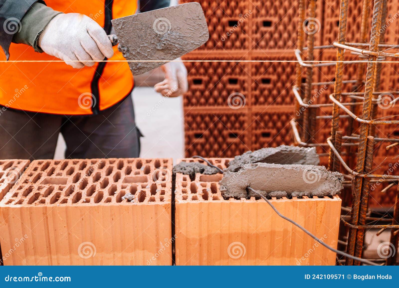 Bricklayer and Mason Working with Bricks and Building Interior Walls of ...