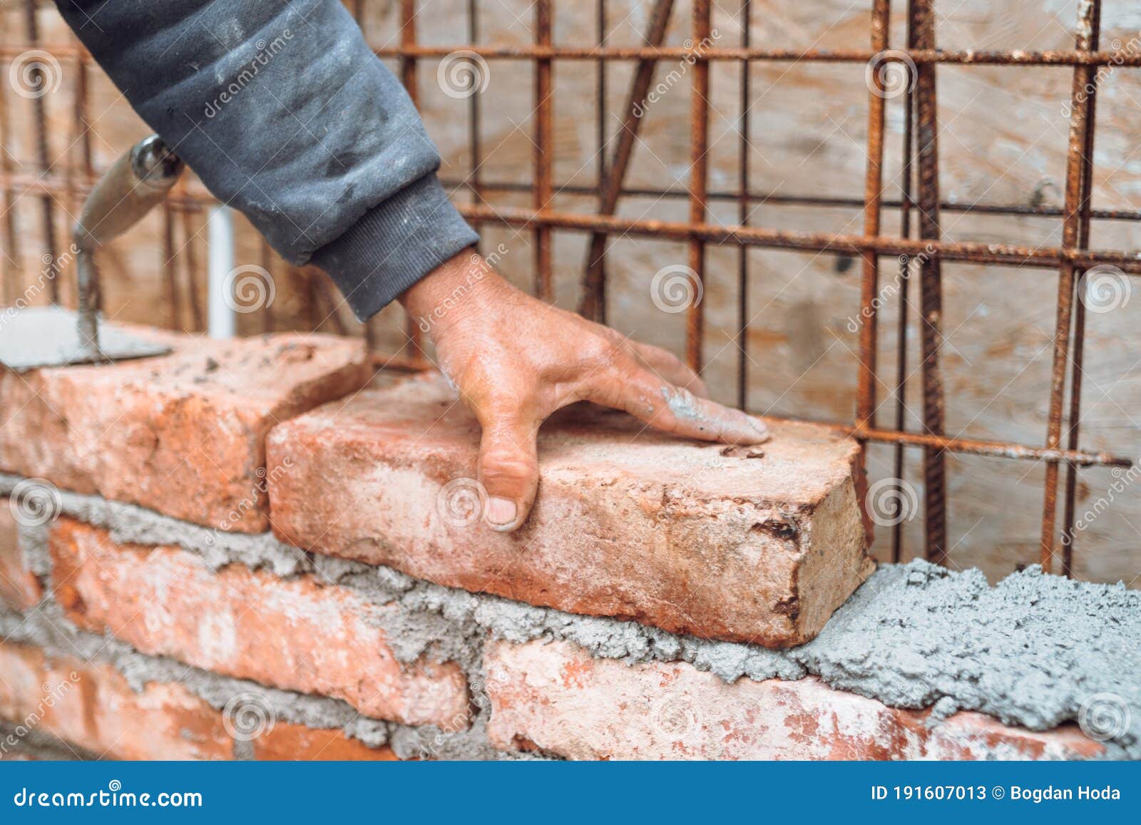 Details of Worker, Bricklayer Placing and Adjusting Bricks ...