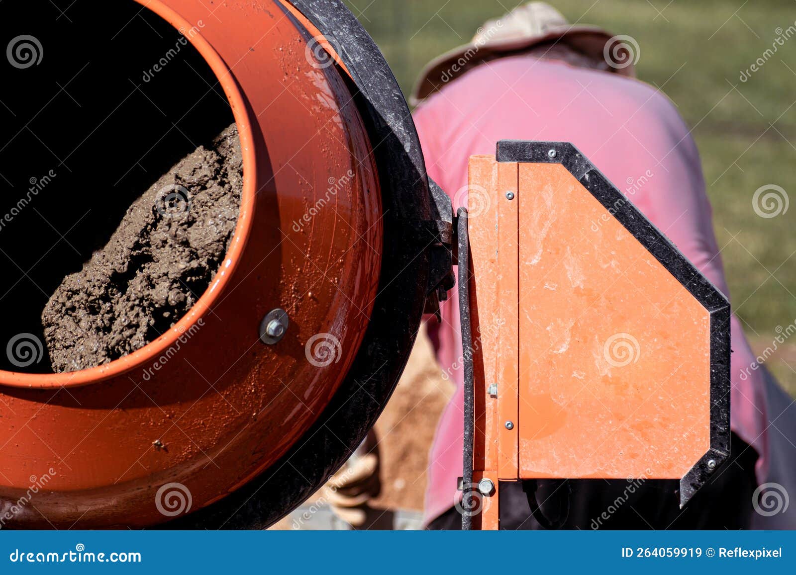 Bricklayer Preparing Concrete with a Cement Mixer To Build a Wall at a ...