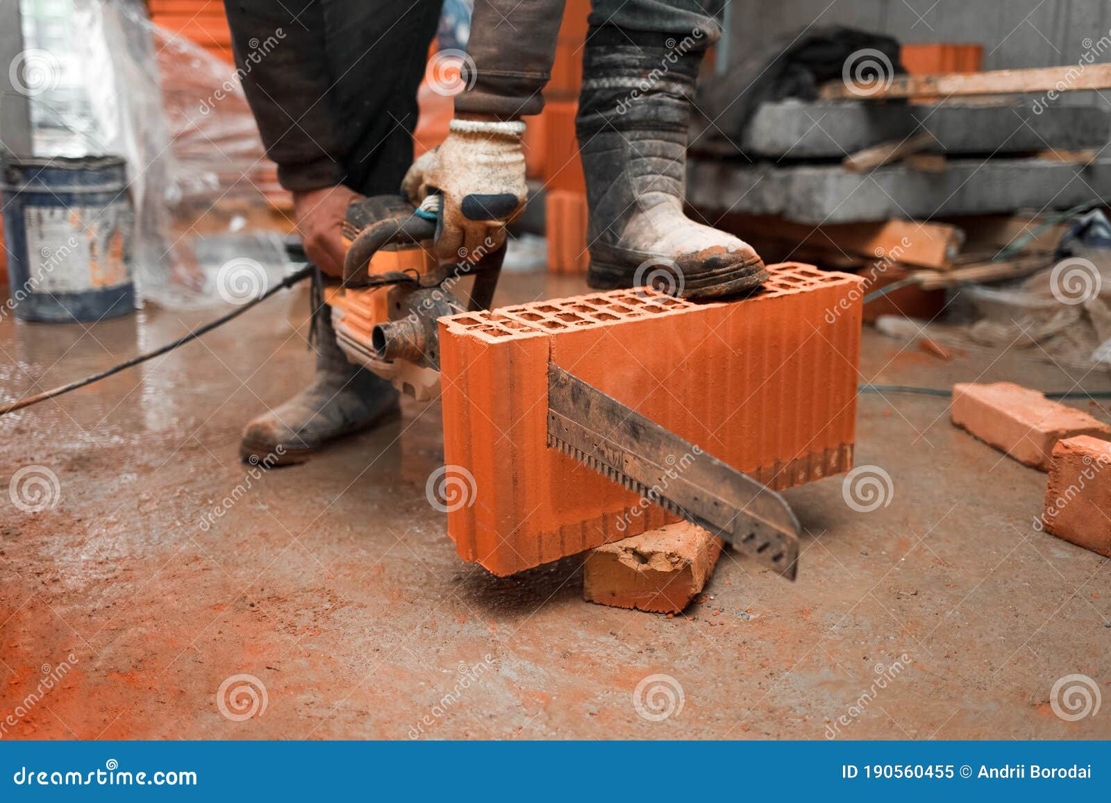 Construction Worker Cuts a Brick with a Saw Stock Image - Image of ...