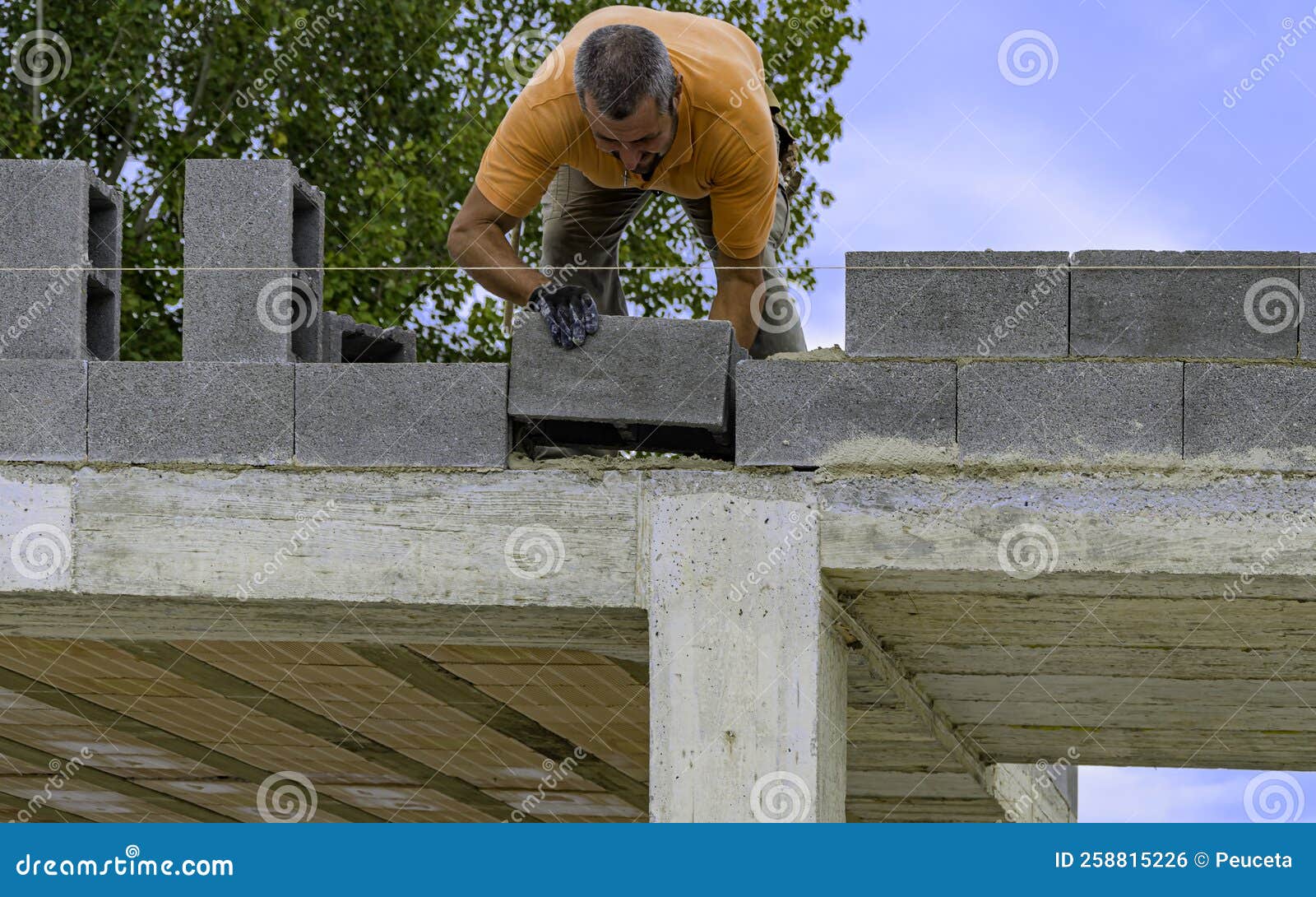 Bricklayer Putting Down Another Row of Bricks in Site Stock Photo ...