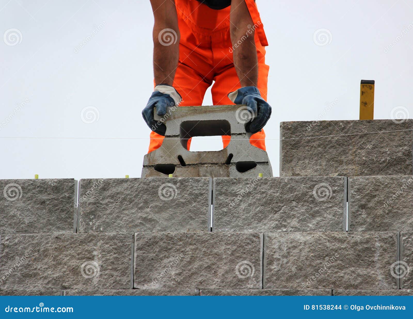 Bricklayer Putting Down Another Row of Bricks in Site during the ...