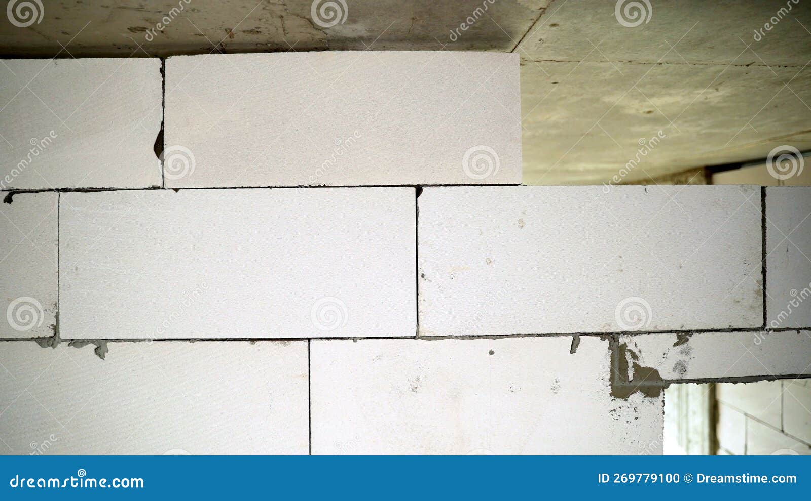 A Bricklayer Sets Up a Masonry Block Wall. Construction of Interior ...