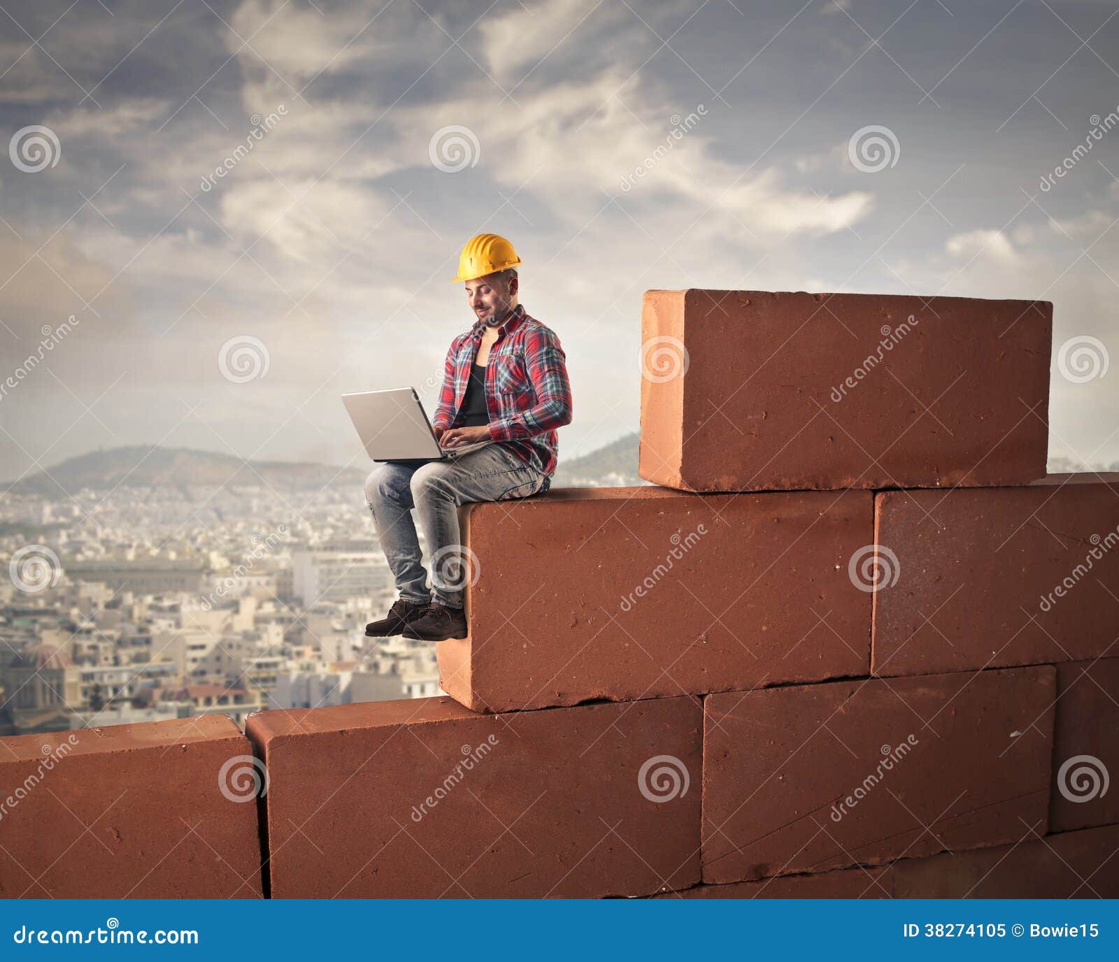 Bricklayer using a laptop stock image. Image of landscaped - 38274105