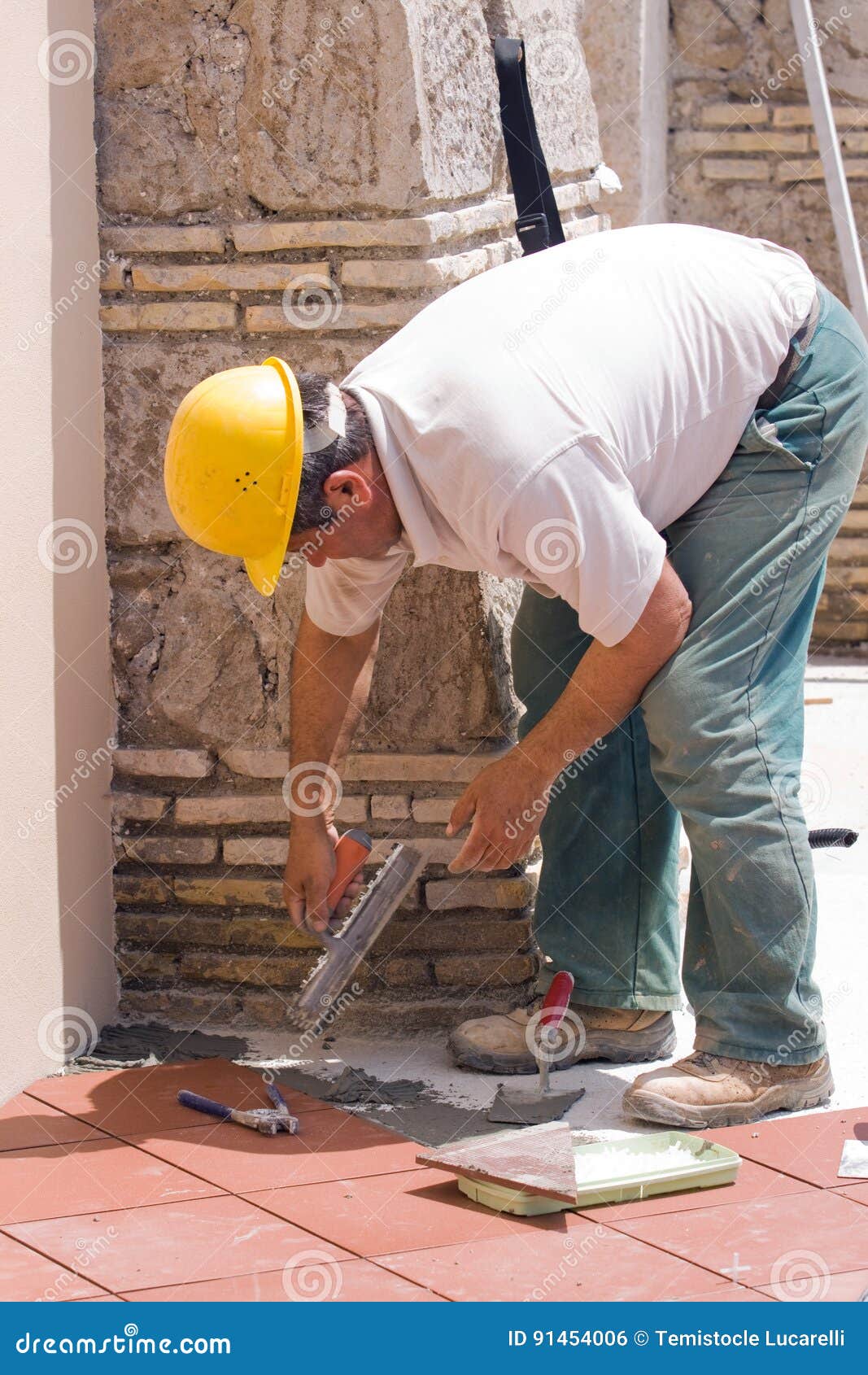 Bricklayer at work stock photo. Image of cement, site - 91454006