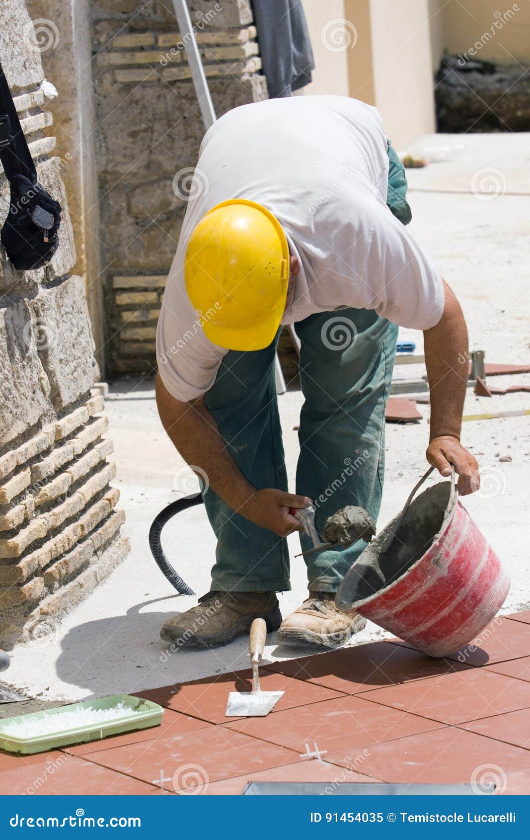 Bricklayer at work stock image. Image of bricklaying - 91454035