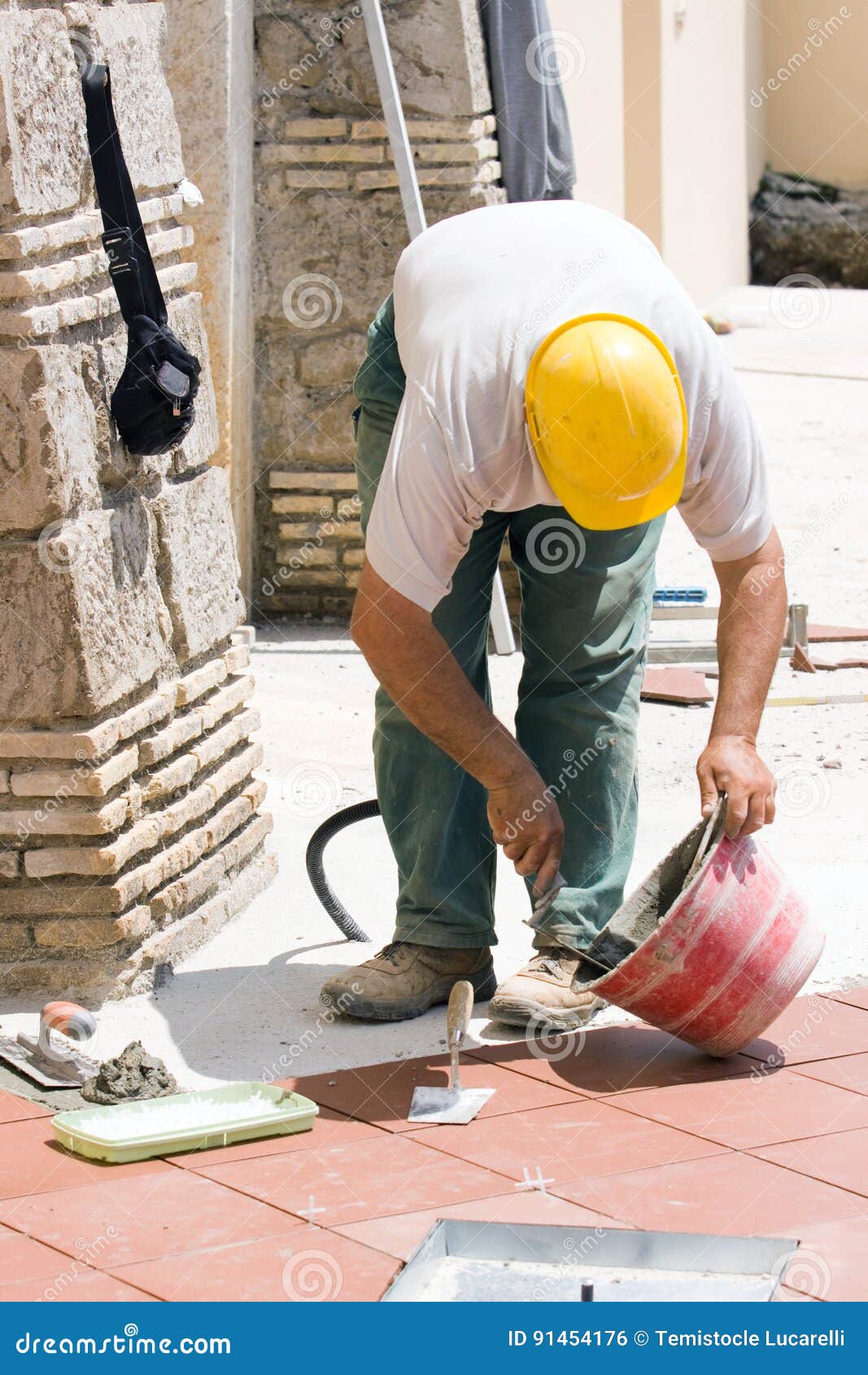 Bricklayer at work stock photo. Image of bricklayer, bricklaying - 91454176