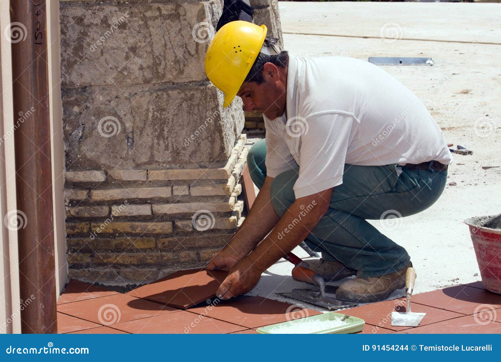 Bricklayer at work stock photo. Image of bricklaying - 91454244