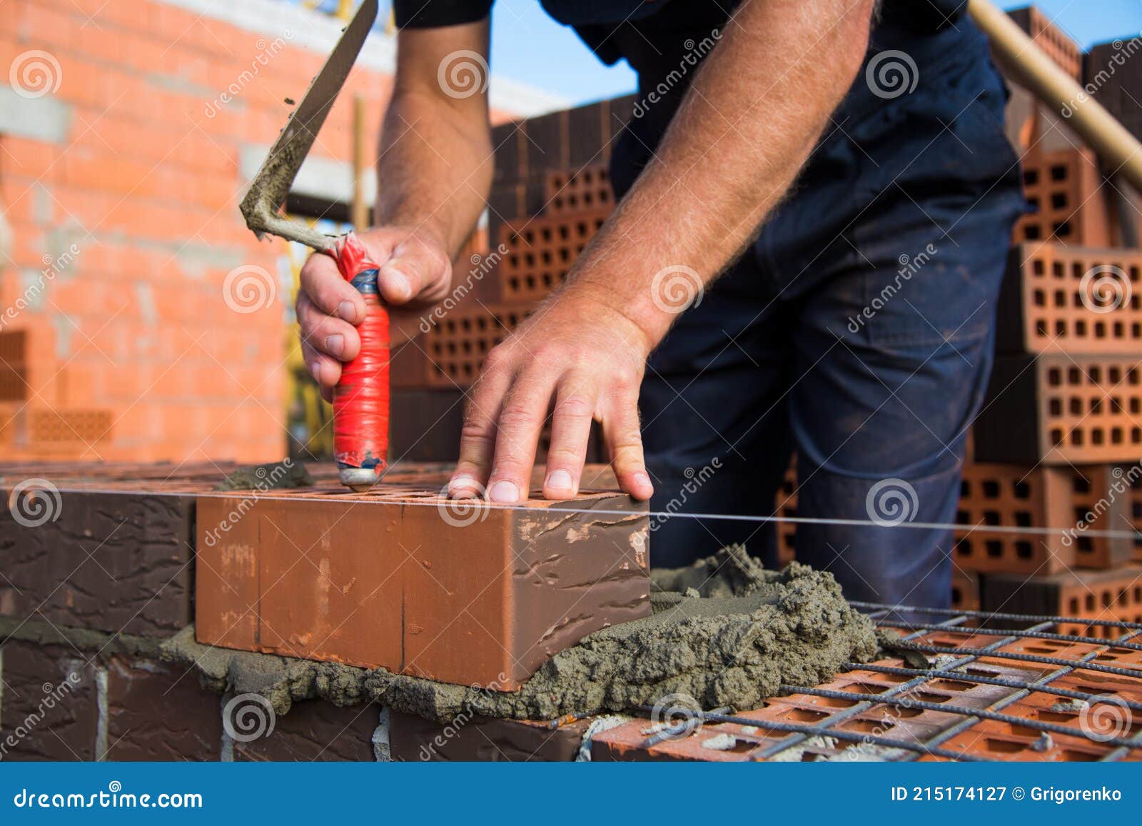 Bricklayer Worker Installing Brick Masonry on Exterior Wall Stock Image ...