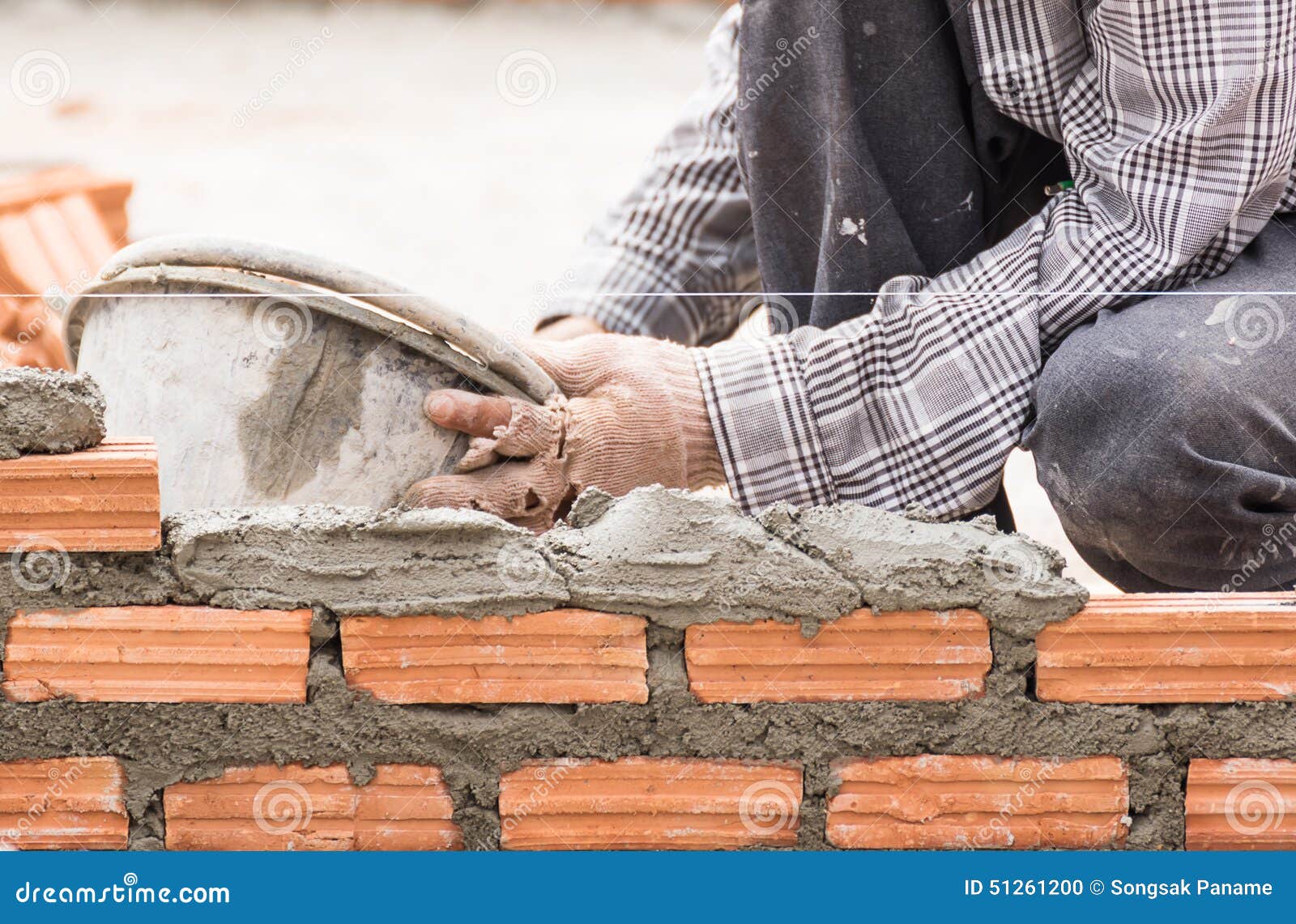 Bricklayer Working in Construction Site of a Brick Wall Stock Photo ...