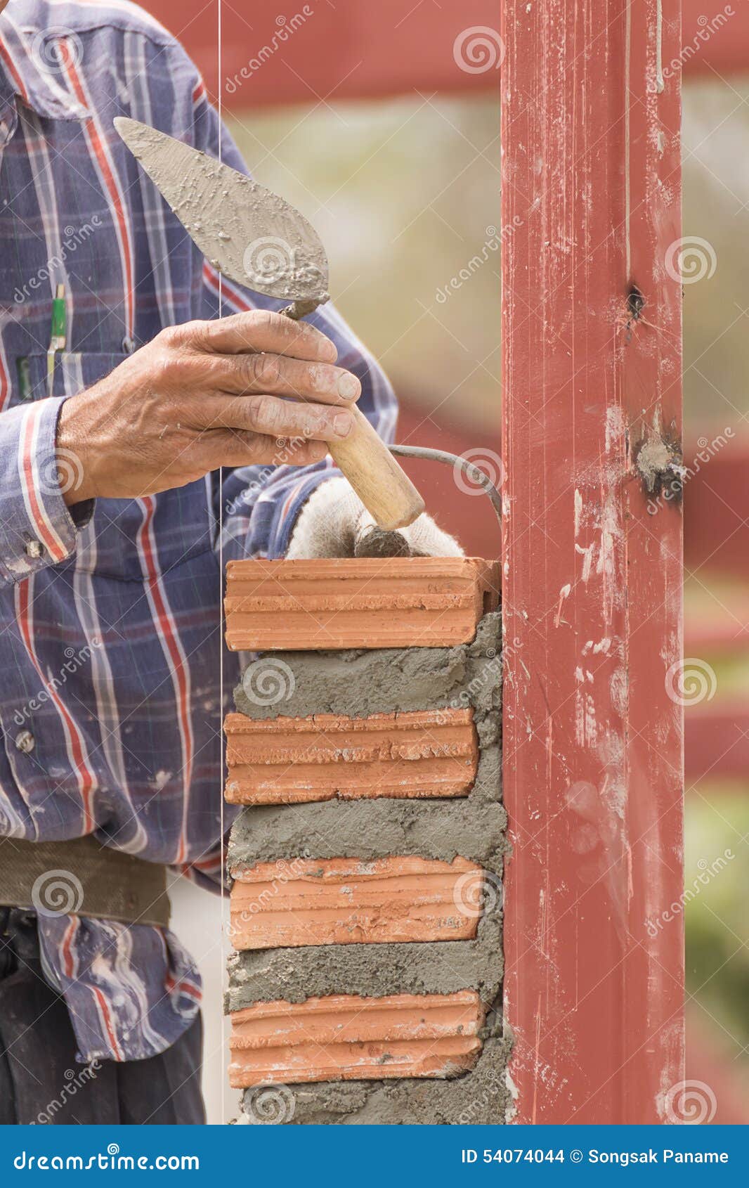 Bricklayer Working in Construction Site of Brick Wall Stock Photo ...