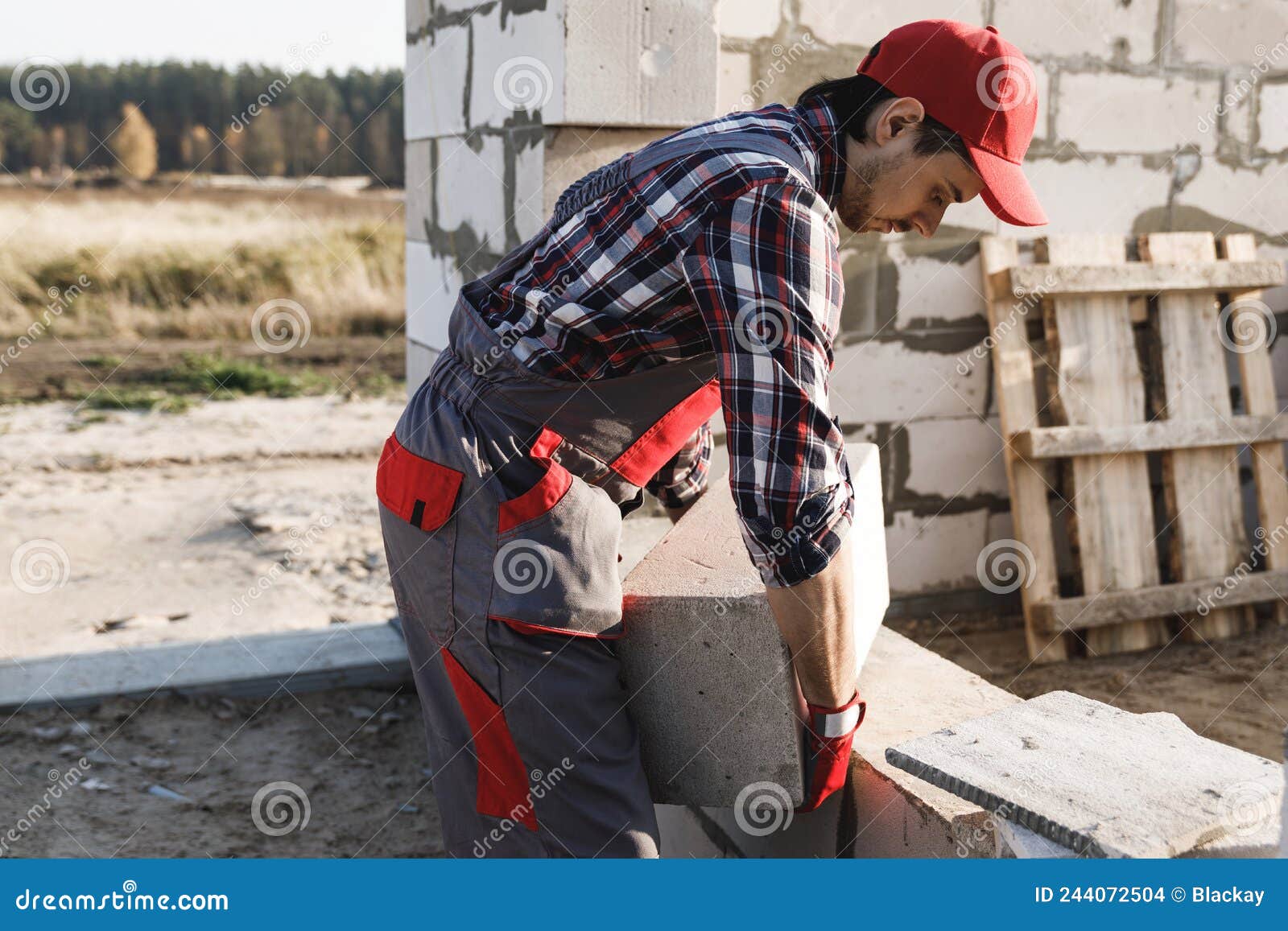 Bricklayer is Working at the Construction Site Stock Photo - Image of ...