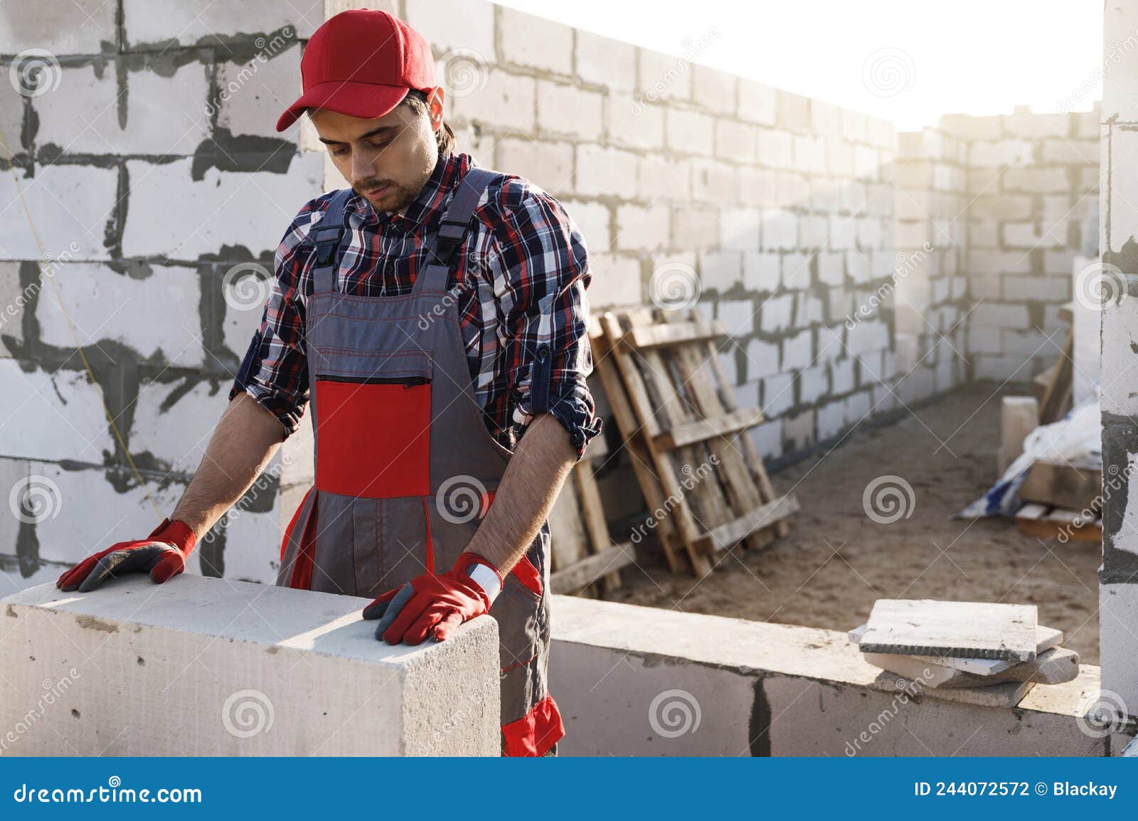 Bricklayer is Working at the Construction Site Stock Photo - Image of ...