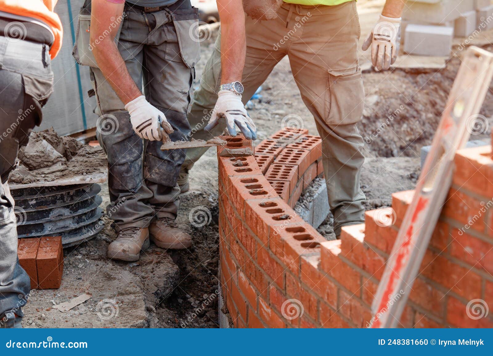 Bricklayer Working With Ceramsite Concrete Blocks. Walling Stock ...