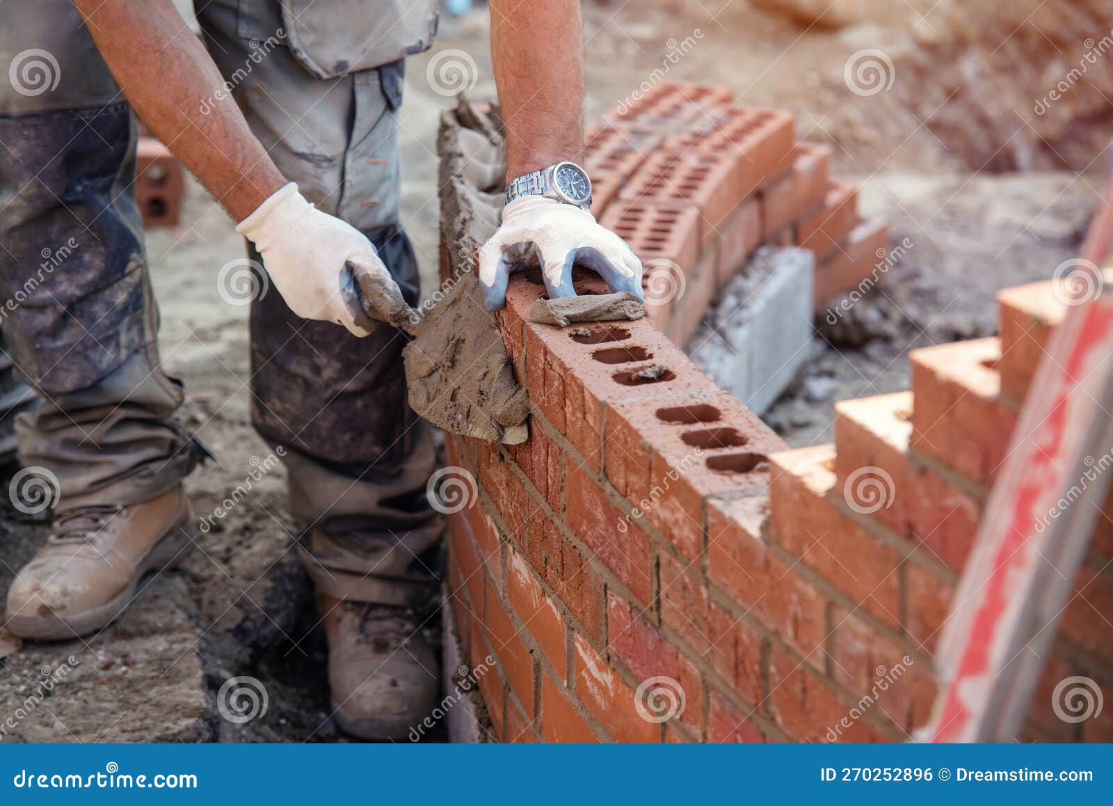 Bricklayer Working With Ceramsite Concrete Blocks. Walling Stock ...