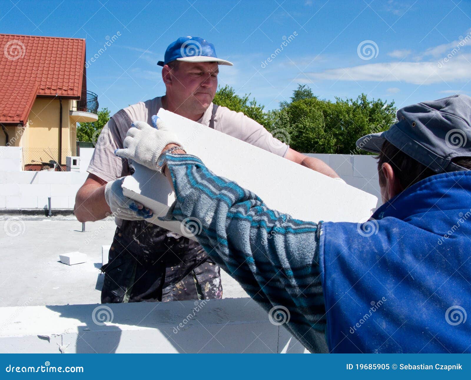 Bricklayers in action stock image. Image of effort, builders - 19685905