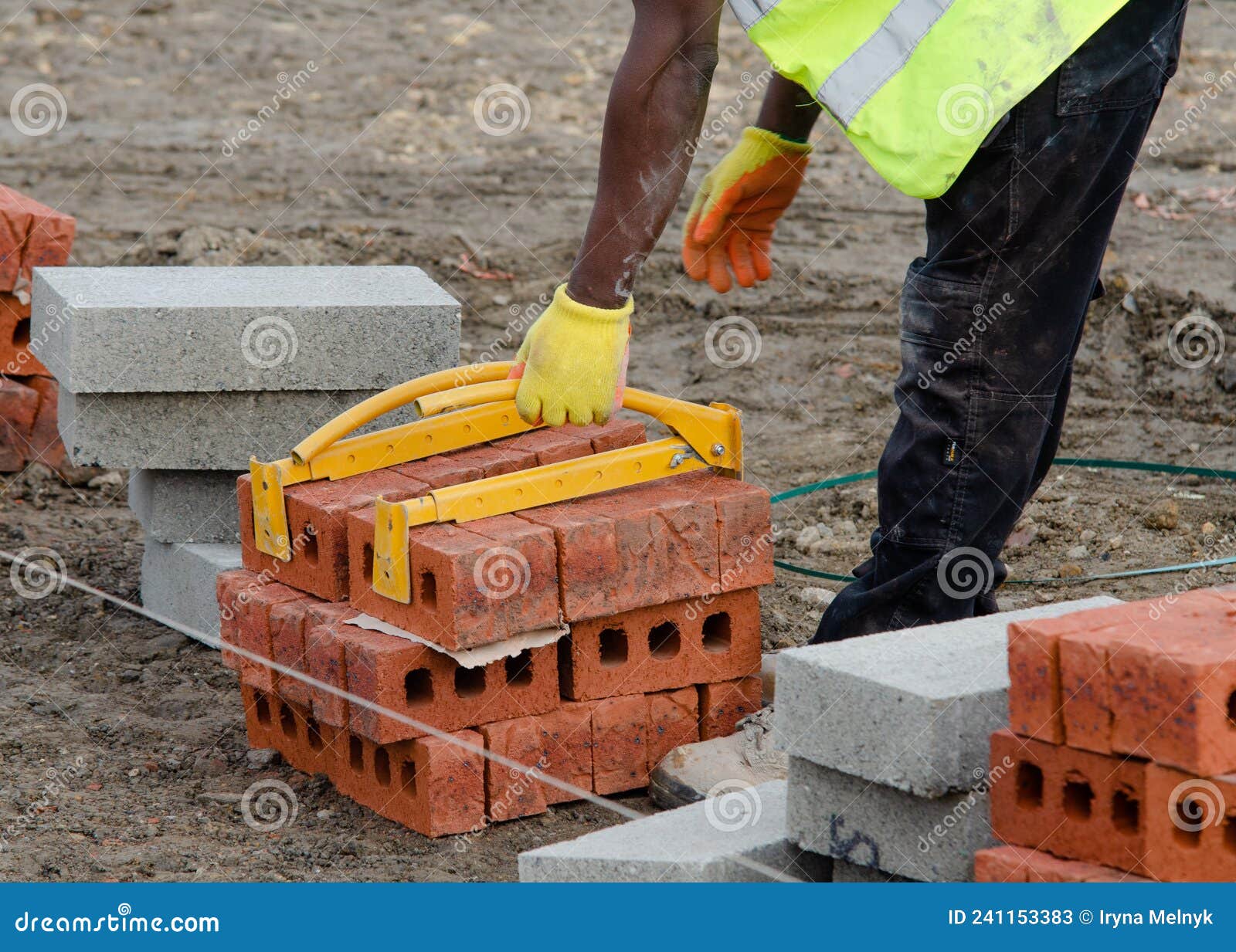 Bricklayers Bringing Bricks Close To His Place of Work Using Brick ...
