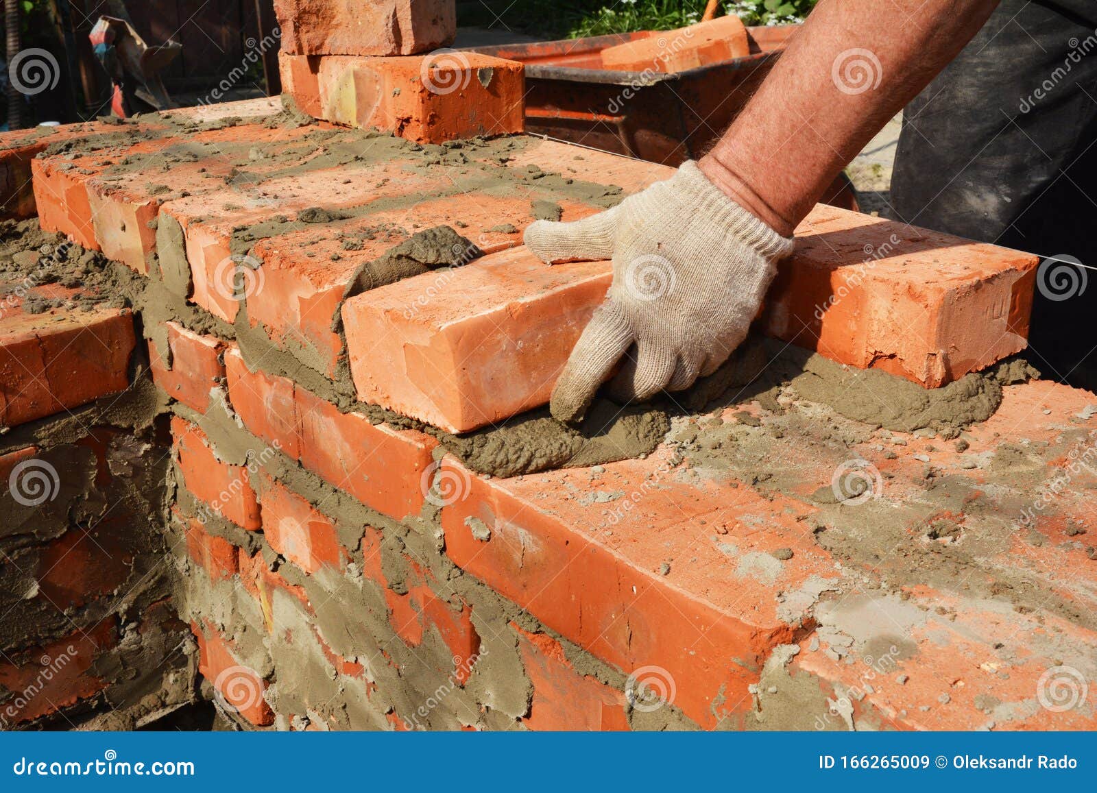 Bricklayers Hands in Masonry Gloves Bricklaying House Wall. Bricklaying ...