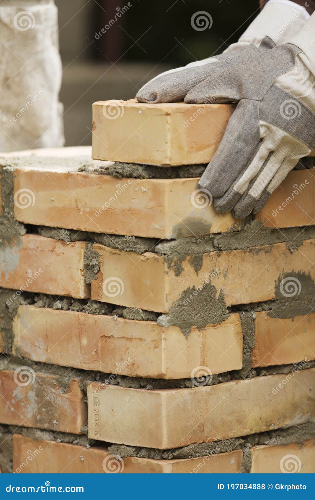 Bricklaying brick wall stock photo. Image of masonry - 197034888