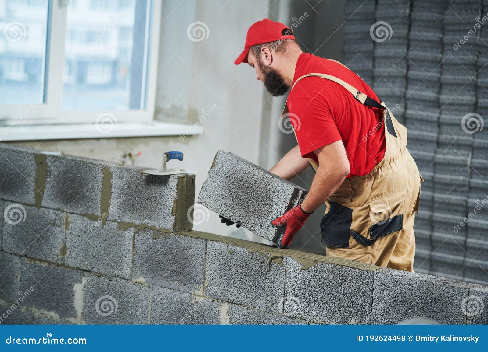 Bricklayer Builder Working with Ceramsite Concrete Blocks. Walling ...