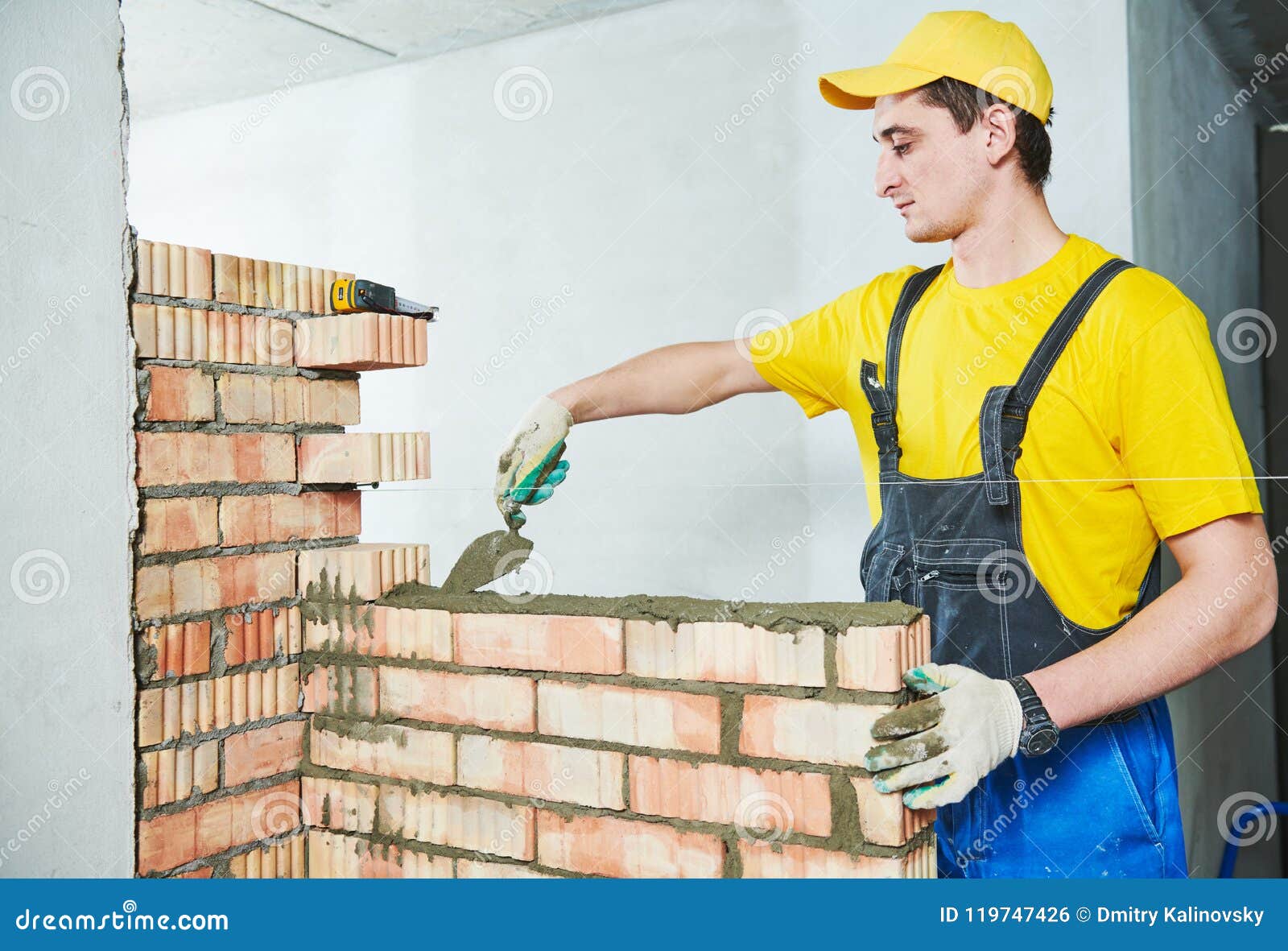 Bricklaying. Construction Worker Building a Brick Wall Stock Photo ...