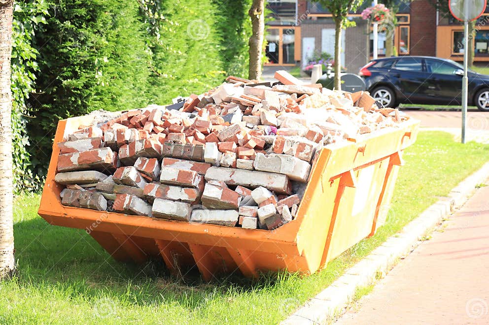 Bricks in a Garbage Dumpster Stock Photo - Image of waste, renovating ...
