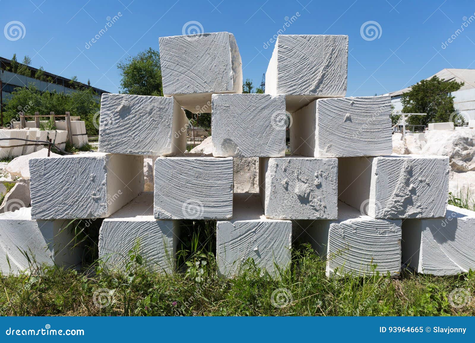 Bricks Made of White Natural Stone Stacked Up on the Grass. Stock Image ...
