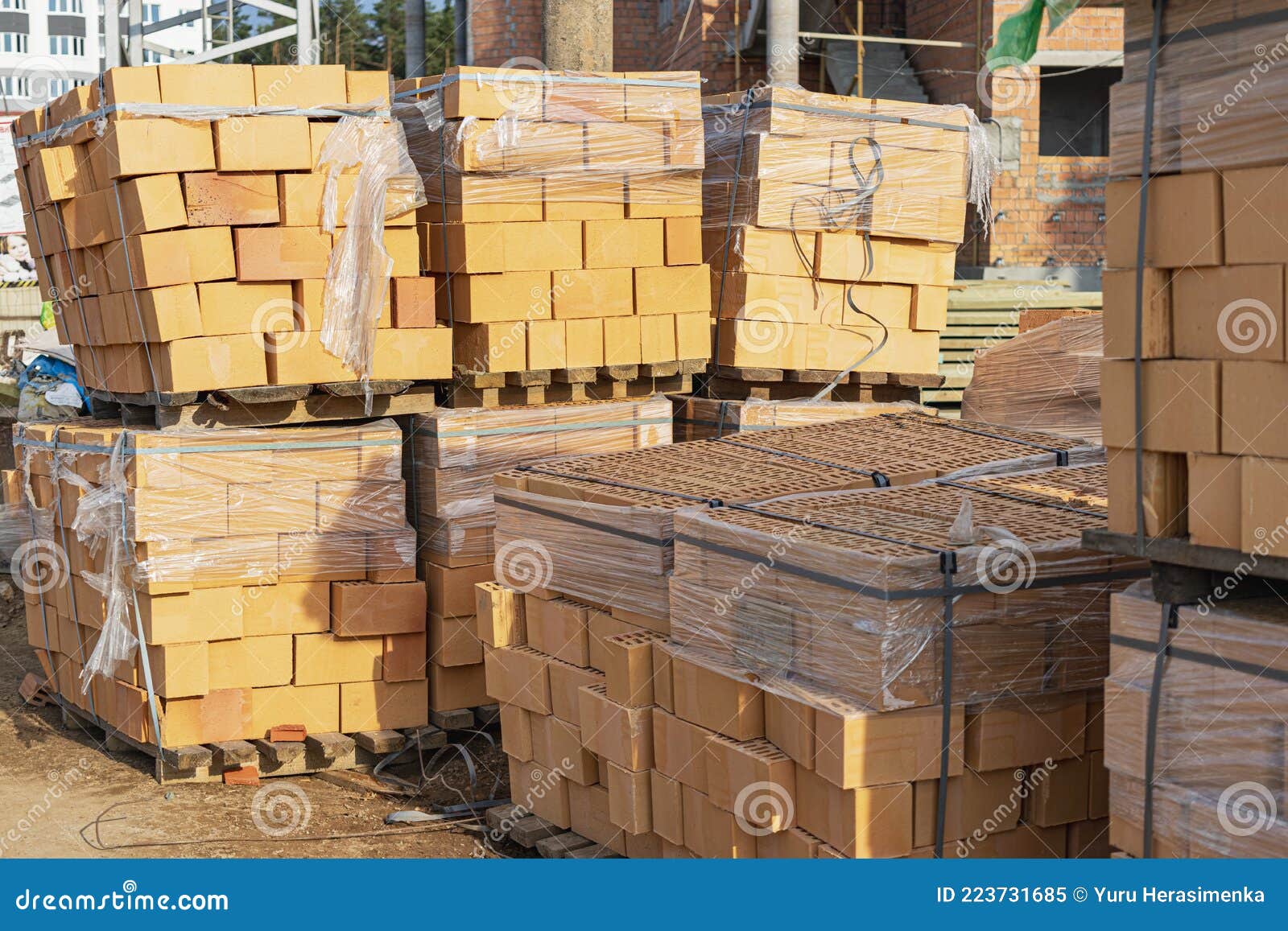Bricks in Pallets on a Construction Site. Construction Materials Stock ...