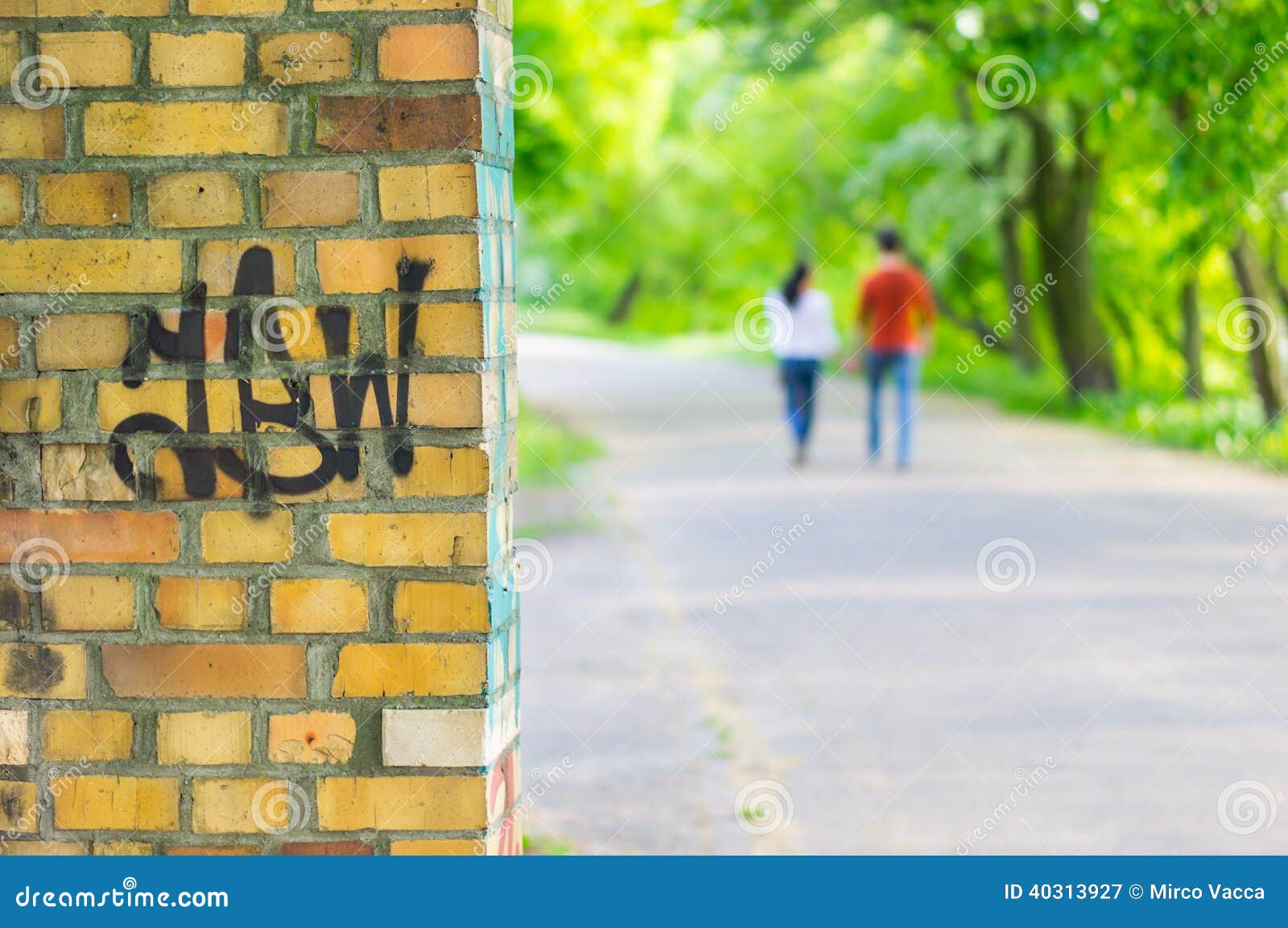 Bricks wall walking couple stock image. Image of trees - 40313927