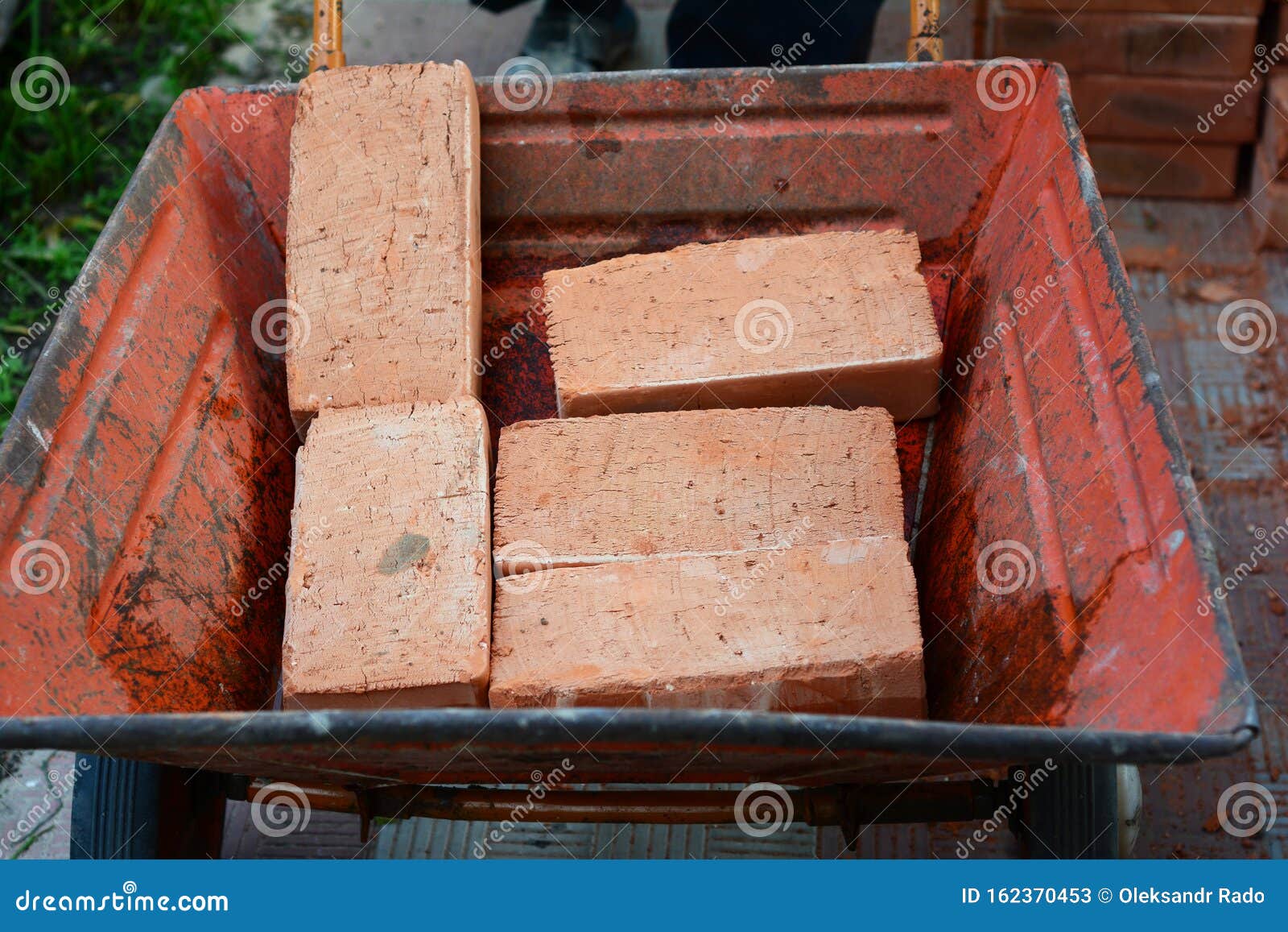 Bricks in the wheel barrow stock image. Image of barrow - 162370453