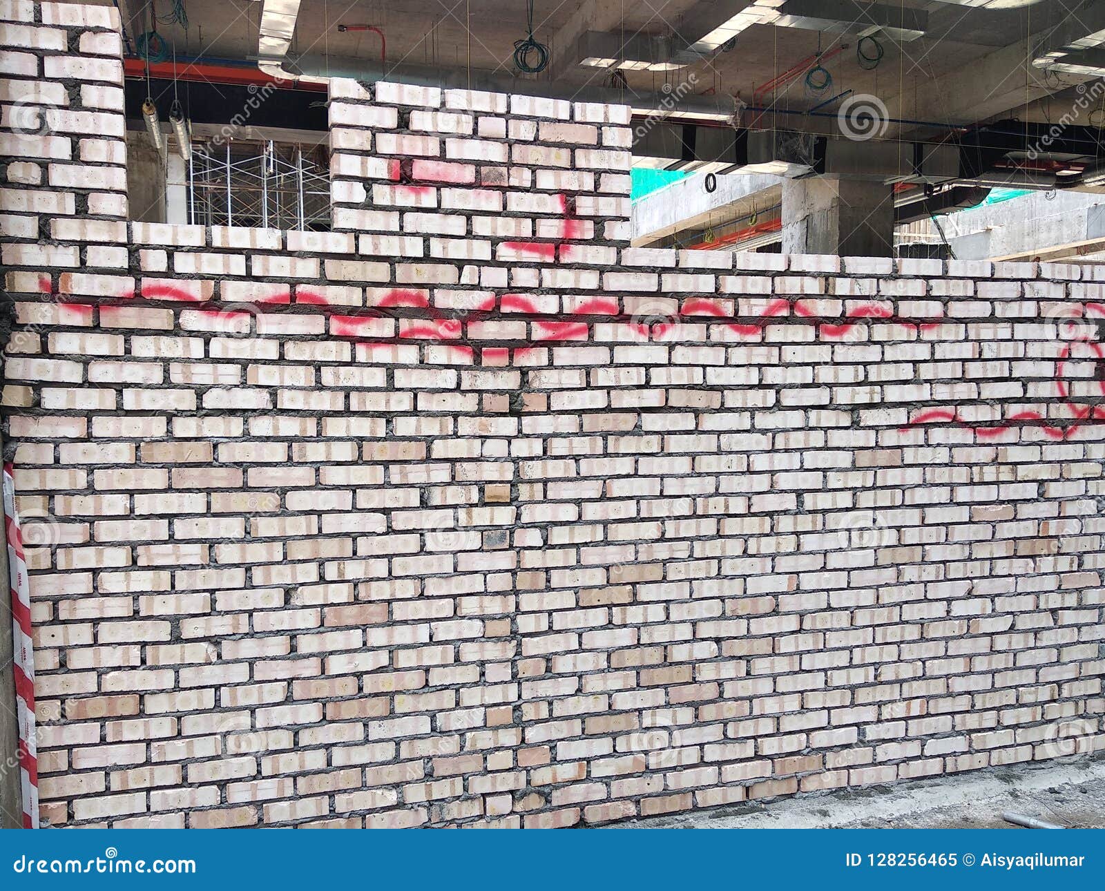 Brickwork by Construction Workers at the Construction Site. Editorial ...
