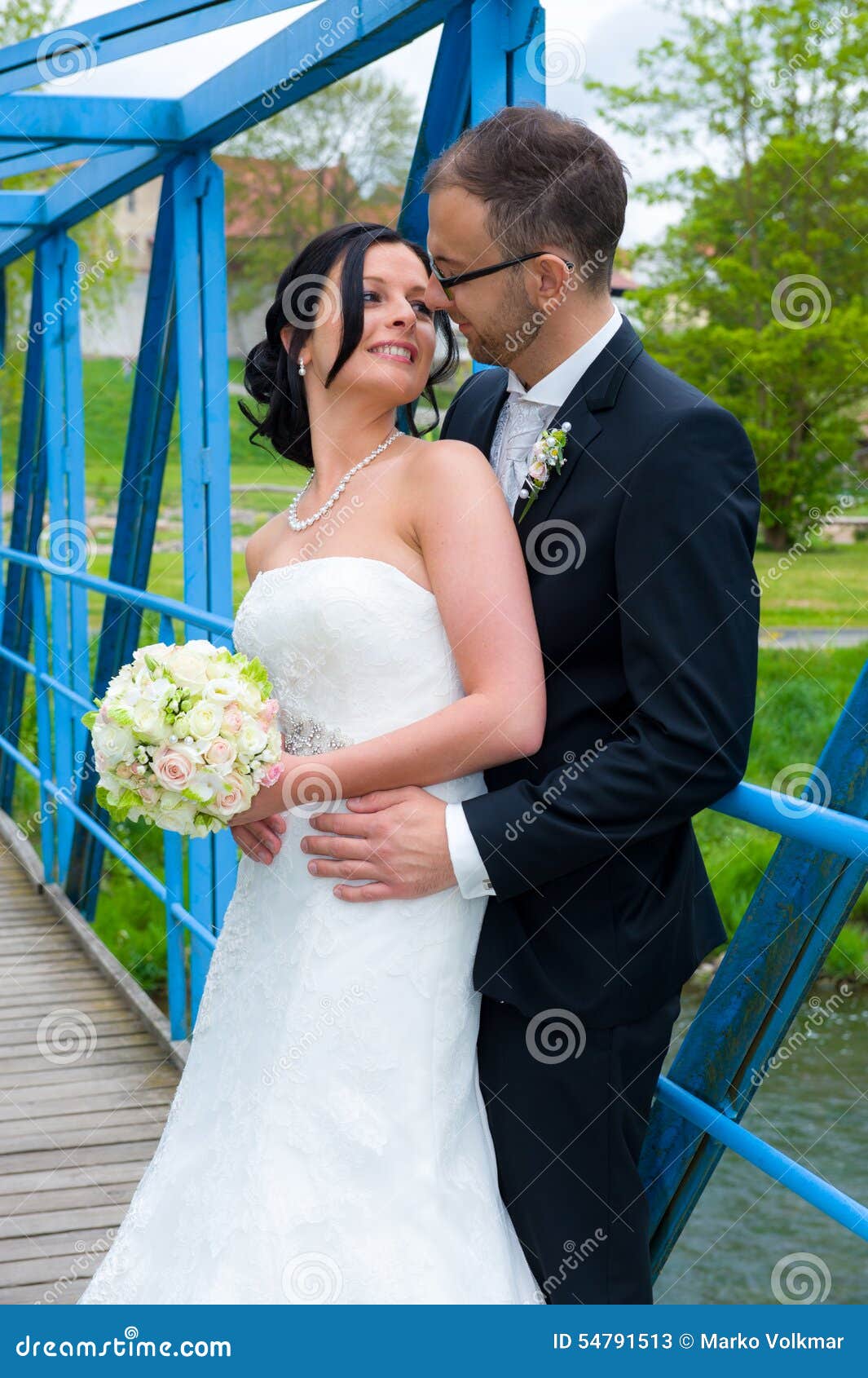 Bridal Couple Standing Together on a Blue Bridge Stock Image - Image of ...