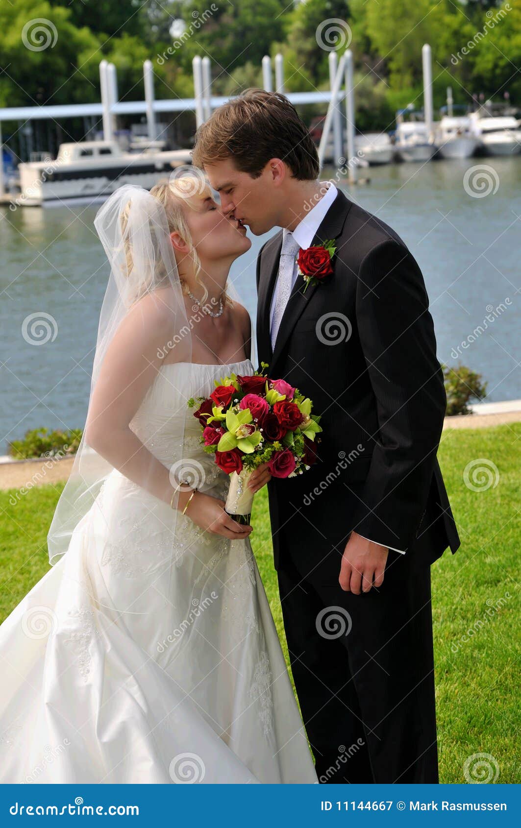Bride Ang Groom Kissing after Their Wedding Stock Image - Image of ...