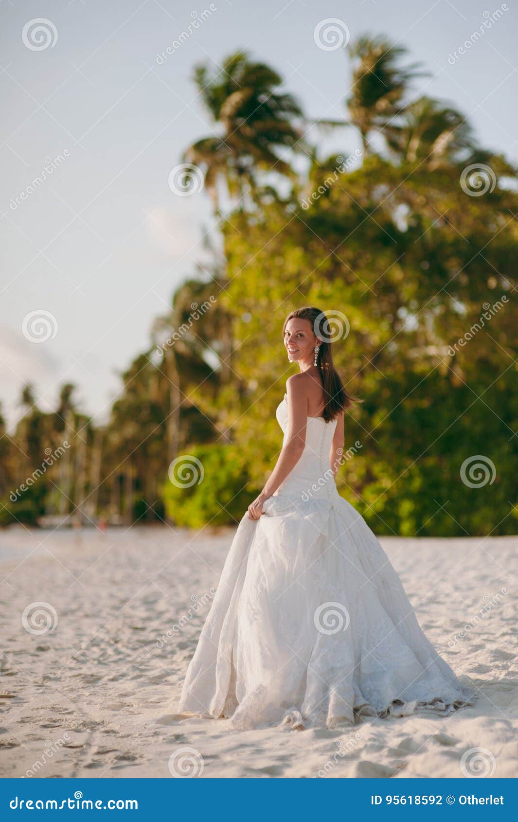 Bride on the beach stock photo. Image of elegance, beautiful - 95618592