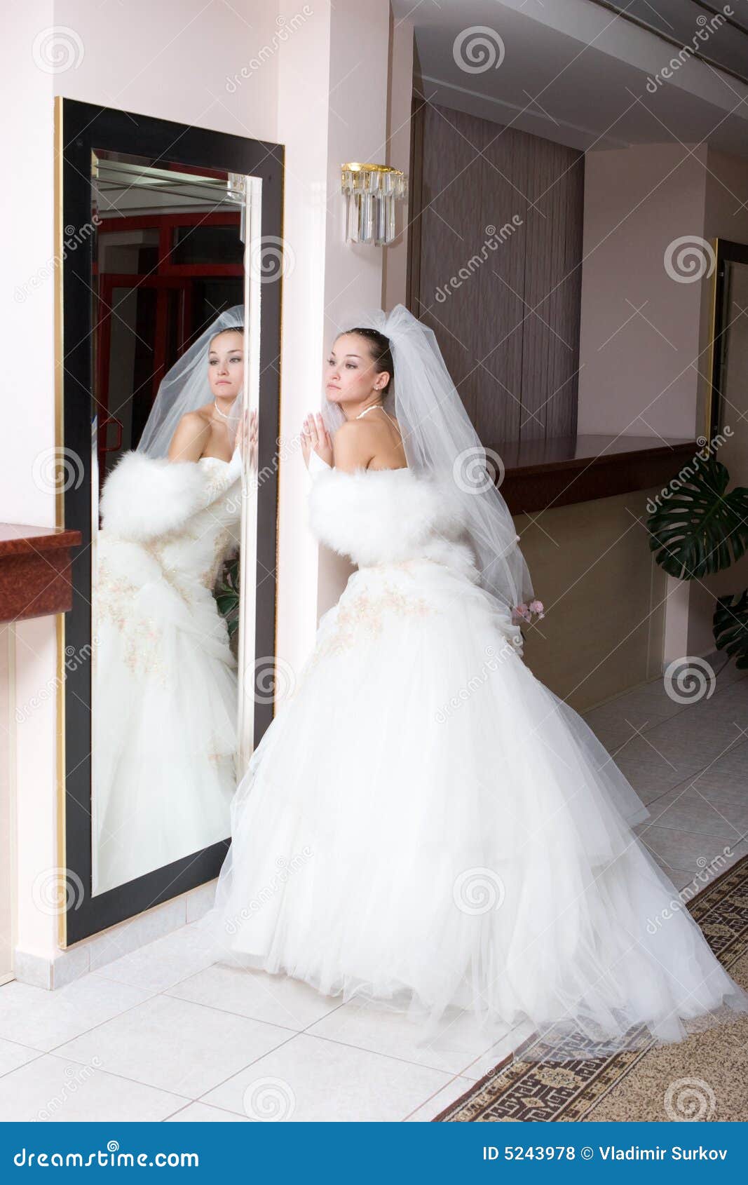 Bride and a big mirror stock photo. Image of love, look - 5243978