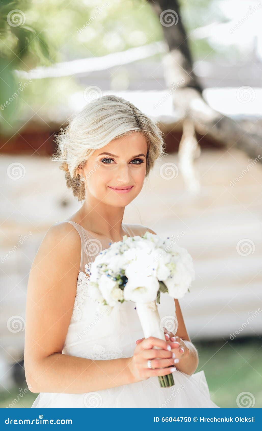 Bride with a Bouquet Posing at the Camera Stock Photo - Image of cute ...